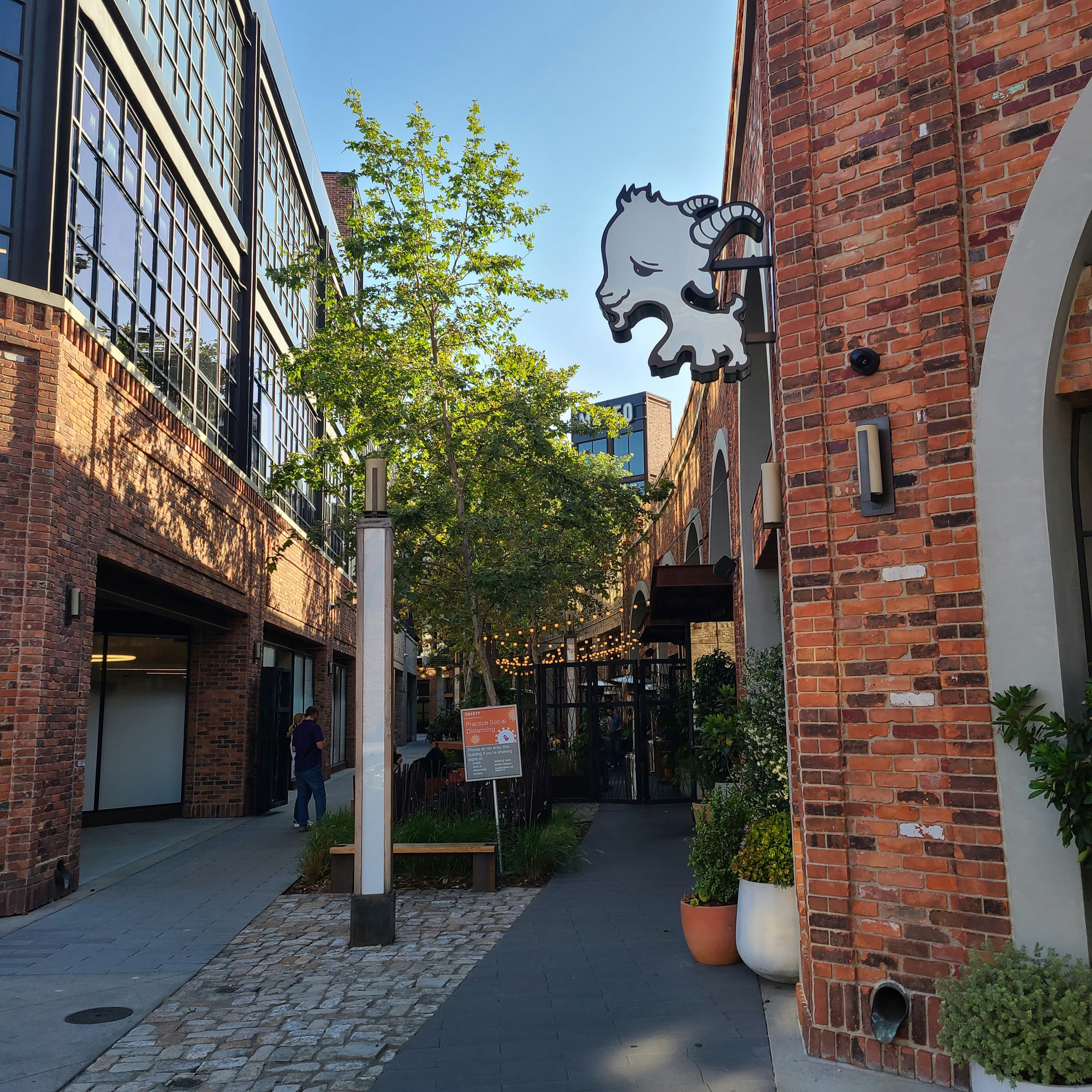 a brick building with a horse sign on the side of it