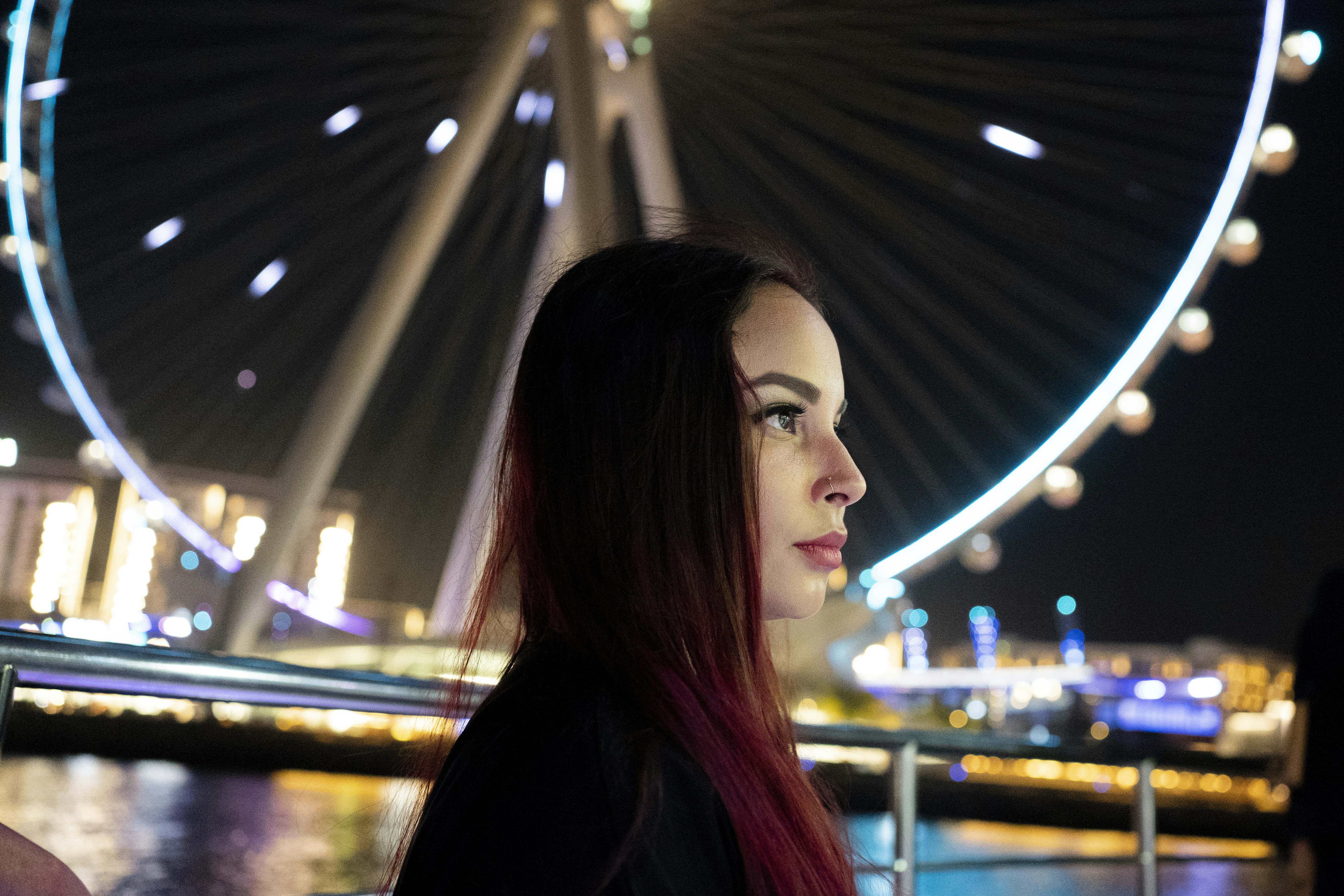 Night Portrait by the Ferris Wheel: Quiet Confidence in Neon Light