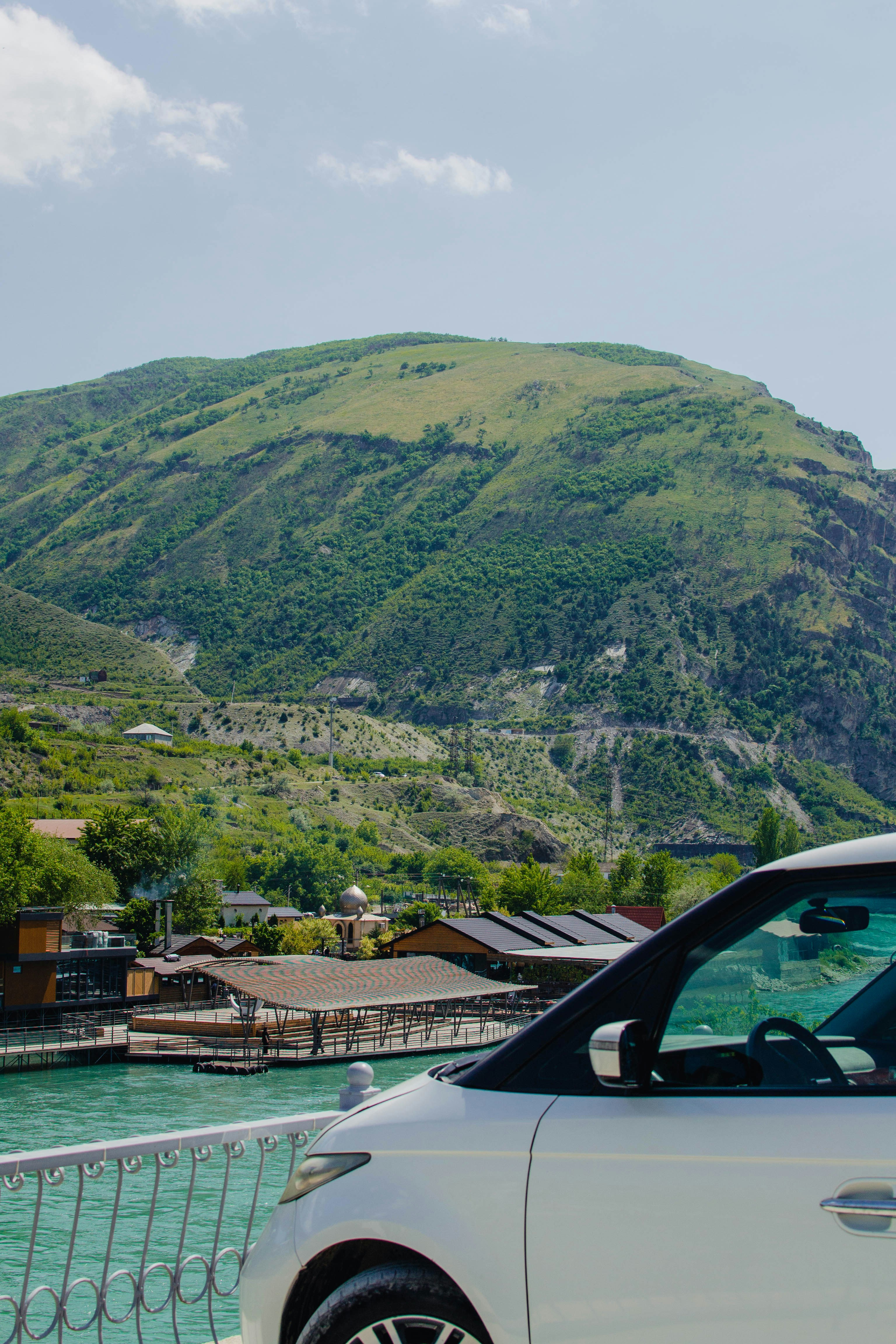 Peaks, Pier, and a Parked Minivan: A Quiet Waterfront Landscape