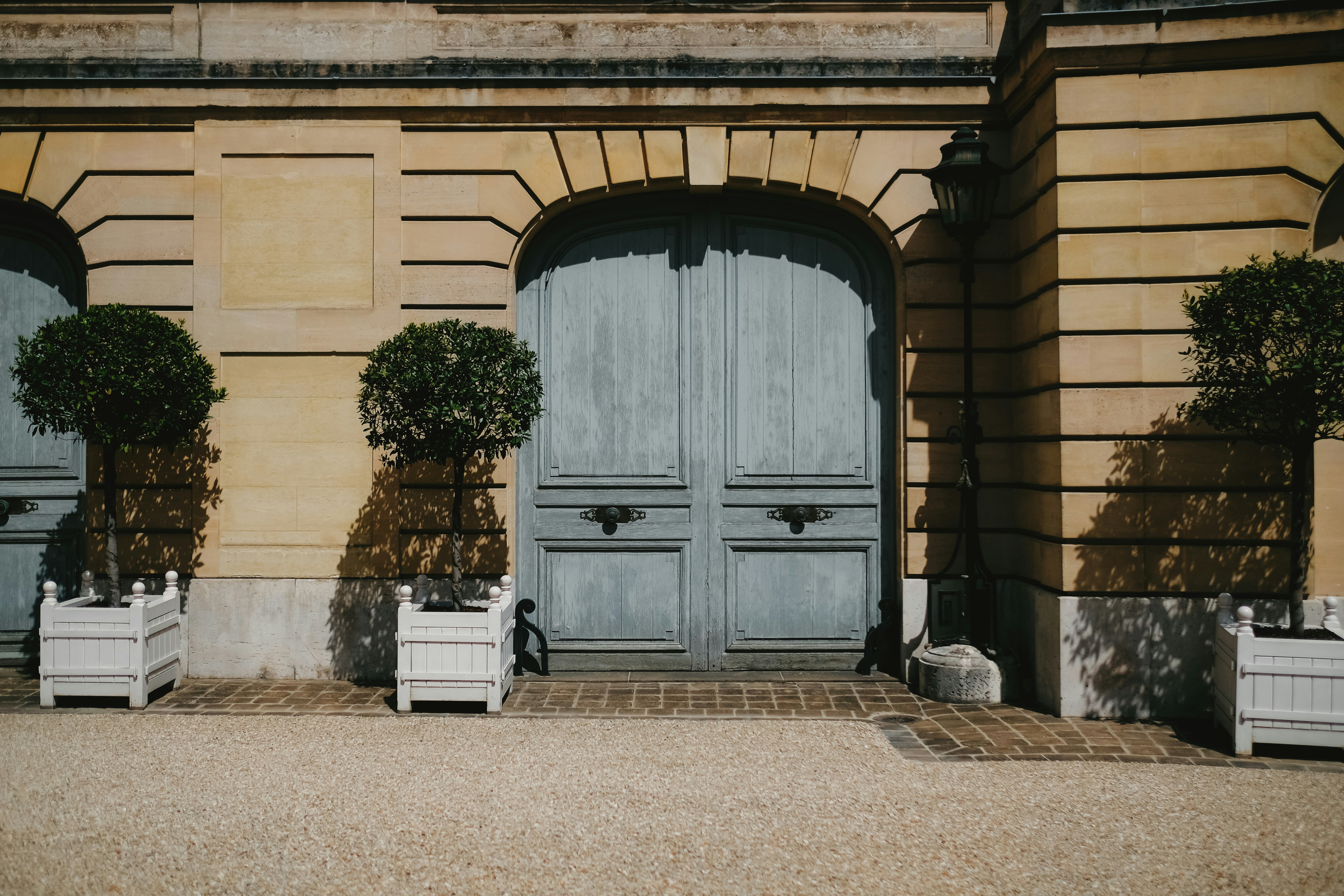 Symmetrical Facade with Tranquil Entry and Potted Topiary