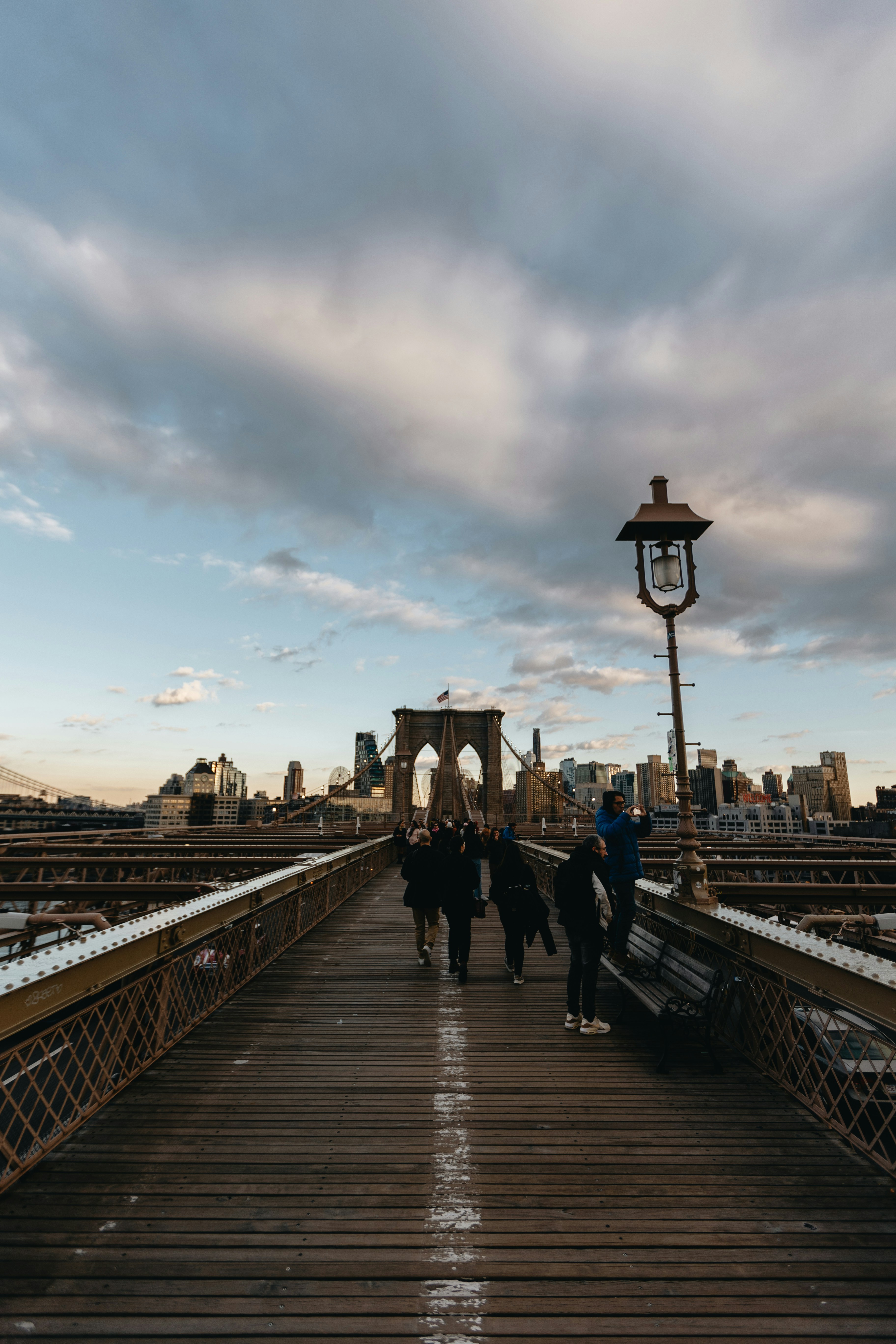 A group of people walking across a bridge photo – Free Ny Image on Unsplash