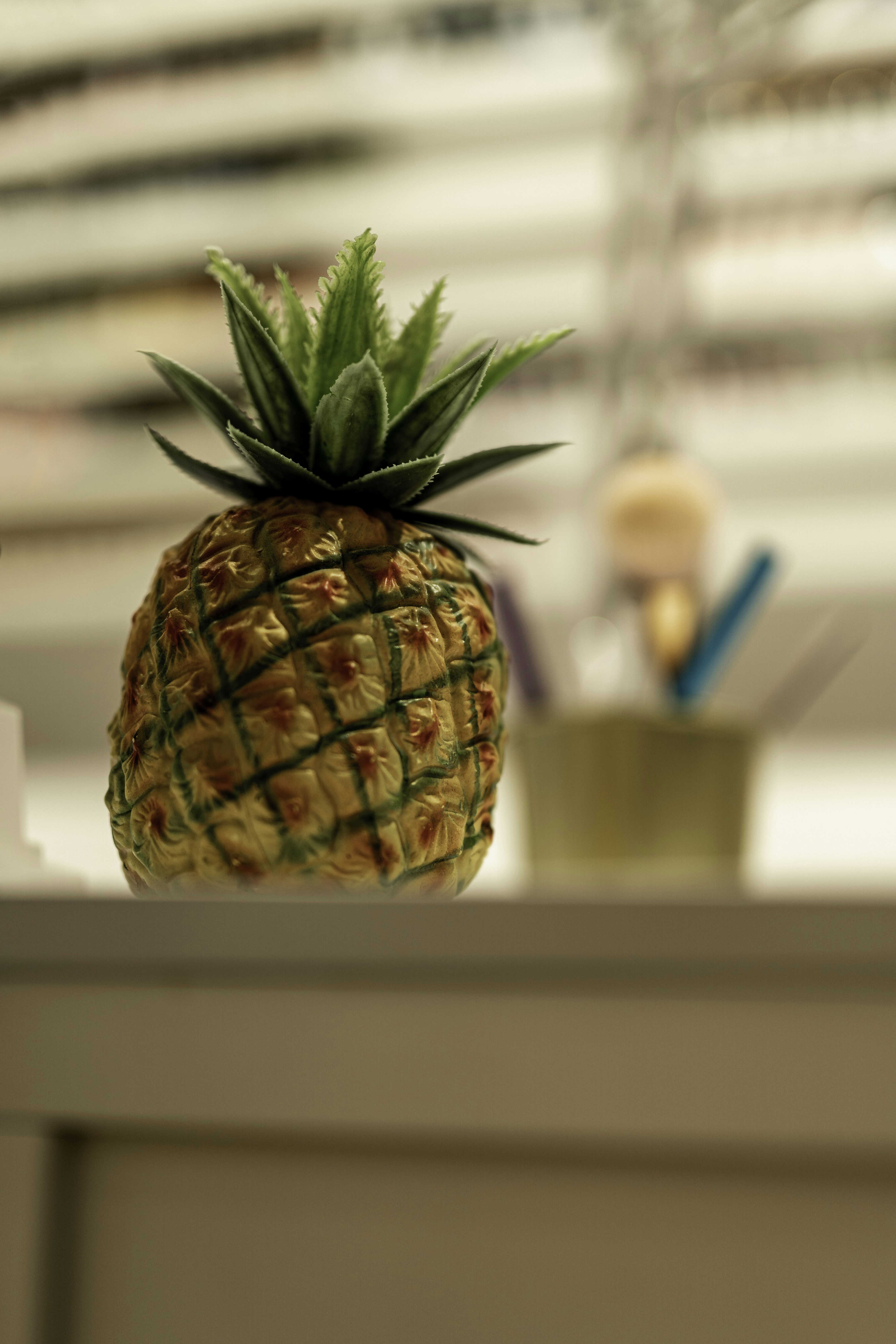 Pineapple in Focus, Quietly Centered on a White Shelf