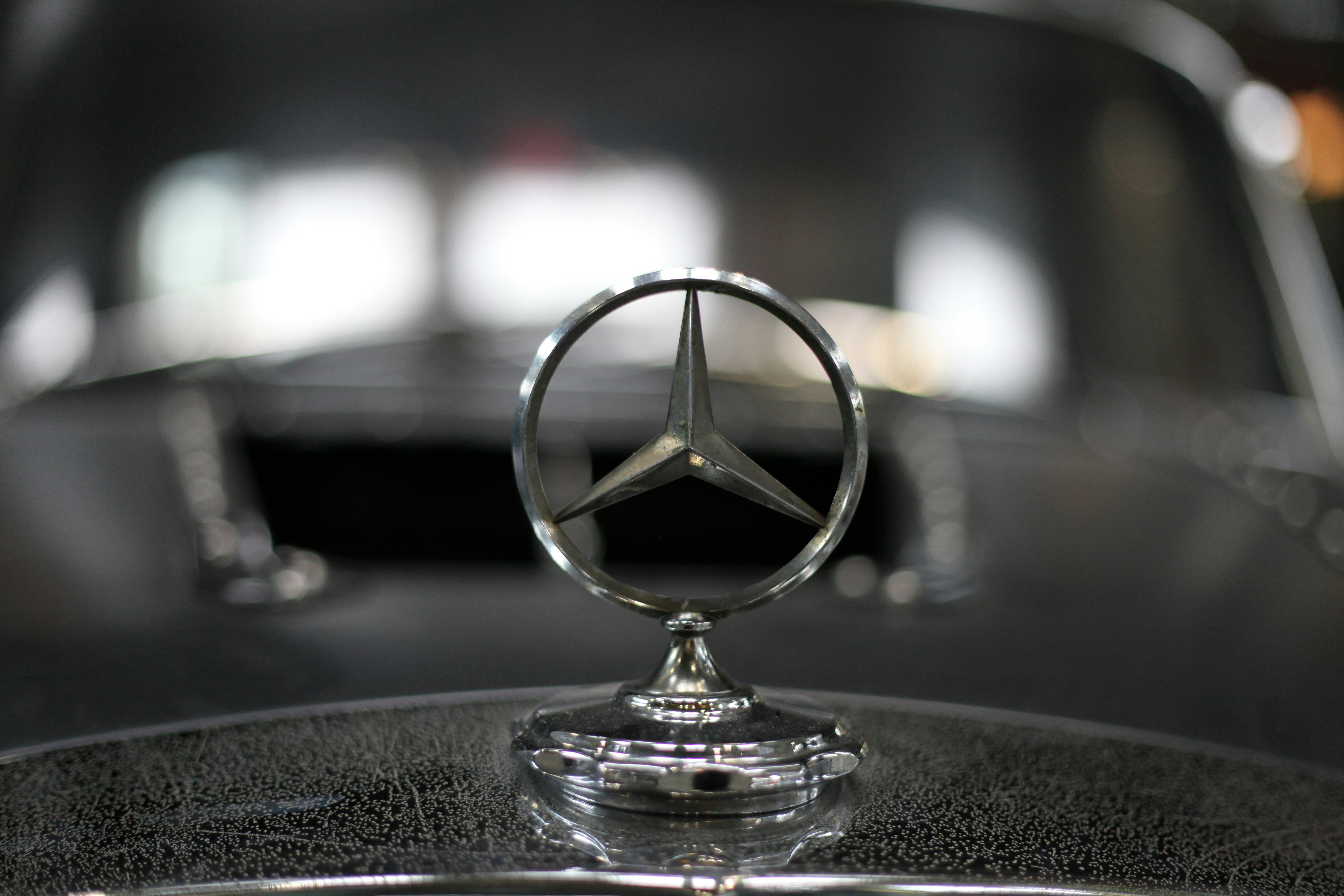 A mercedes emblem on the hood of a car photo – Free Munich Image on ...