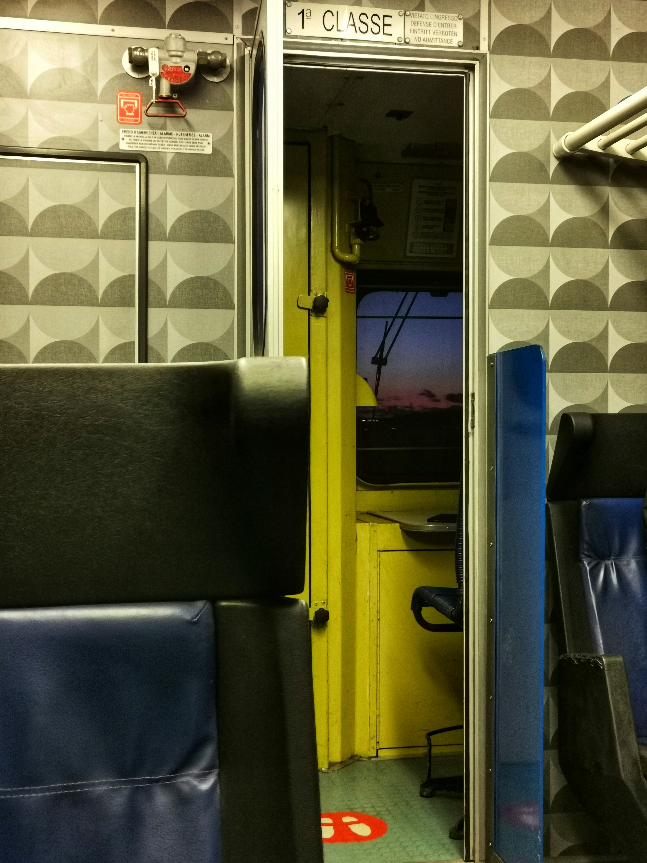 Yellow Threshold at Dusk: A Nostalgic Train Car Interior