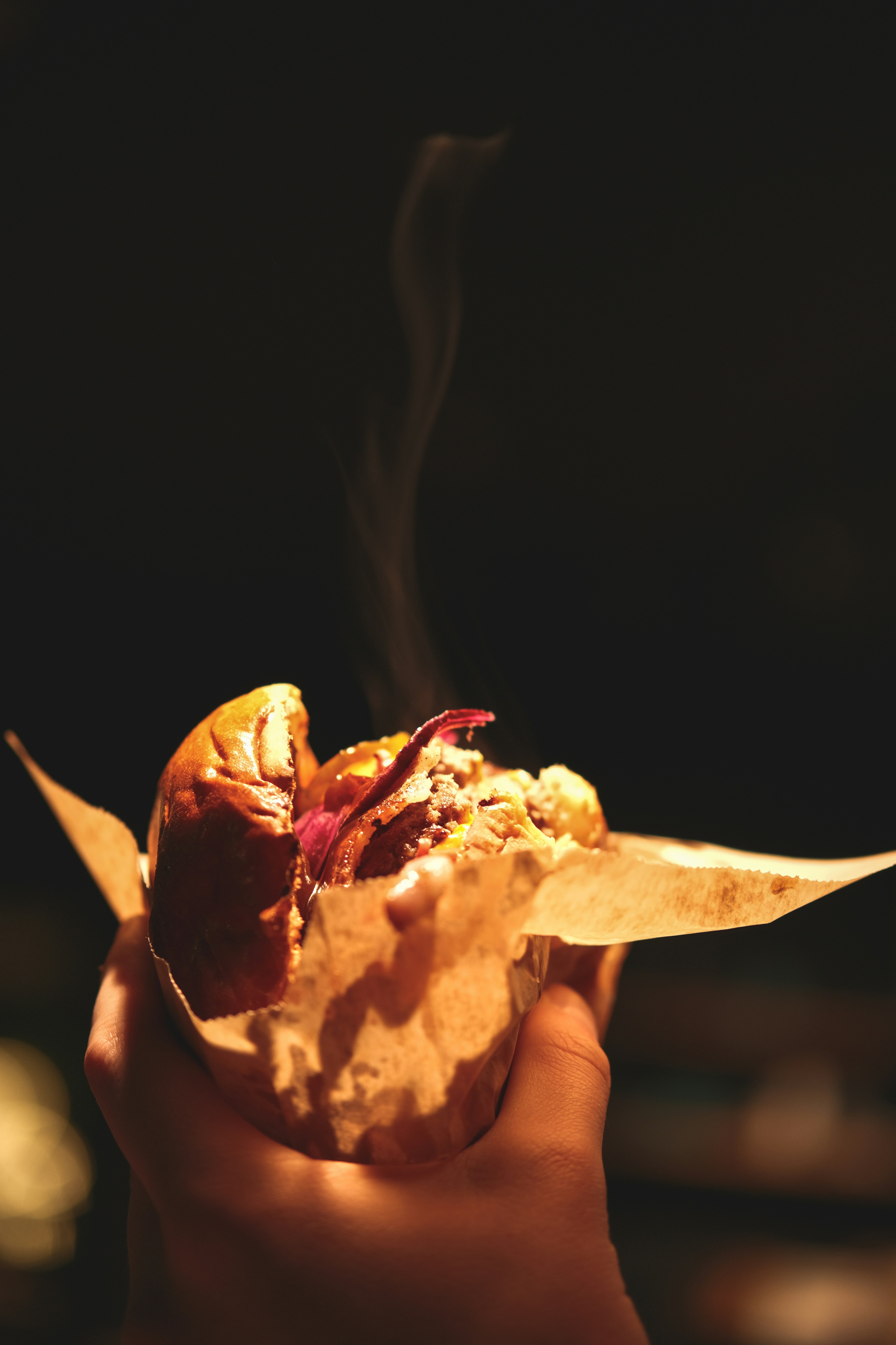 Ember-Glazed Steam Bun Grasped in Velvet Night