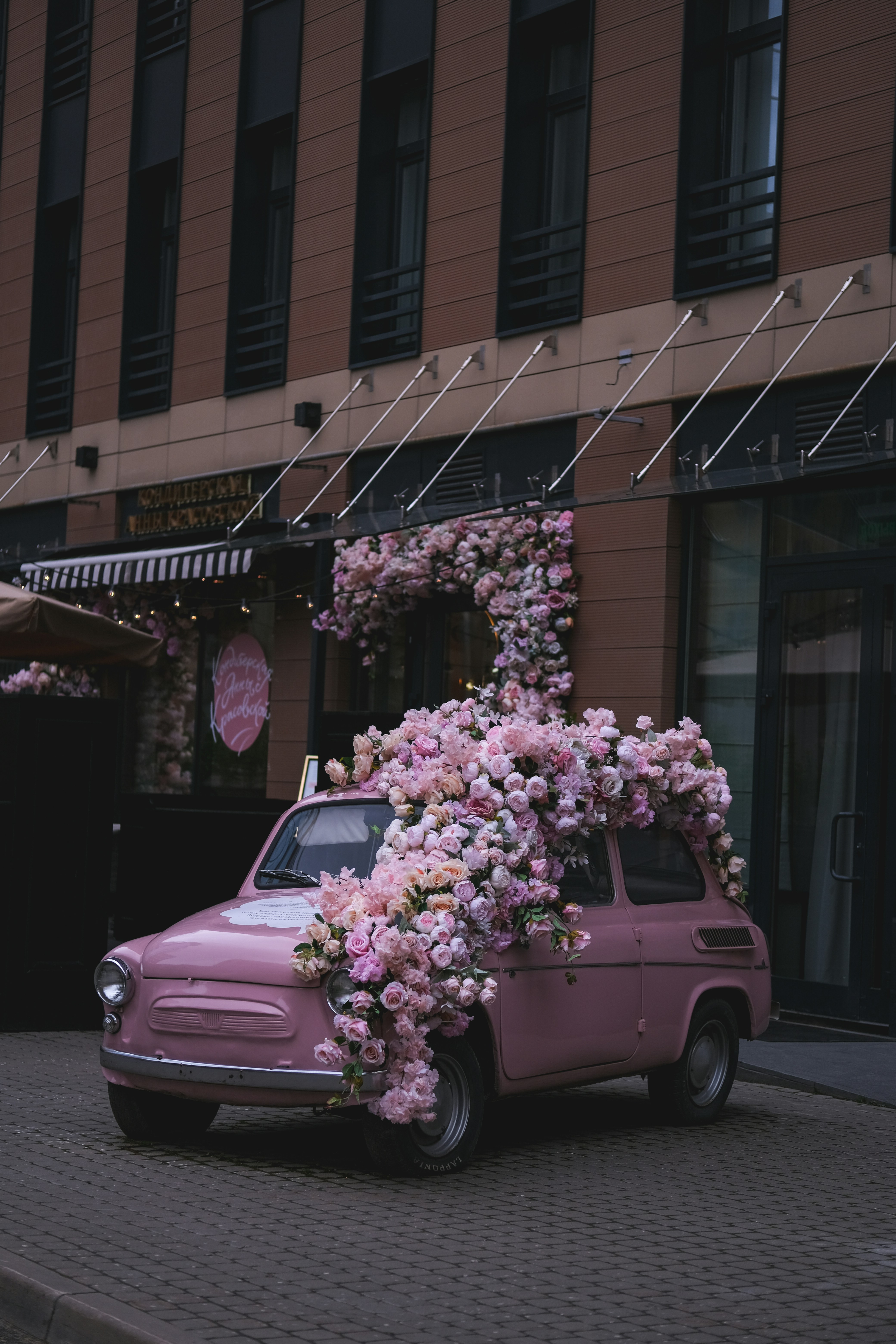 A pink car parked on the side of the road photo – Free Grey Image on ...