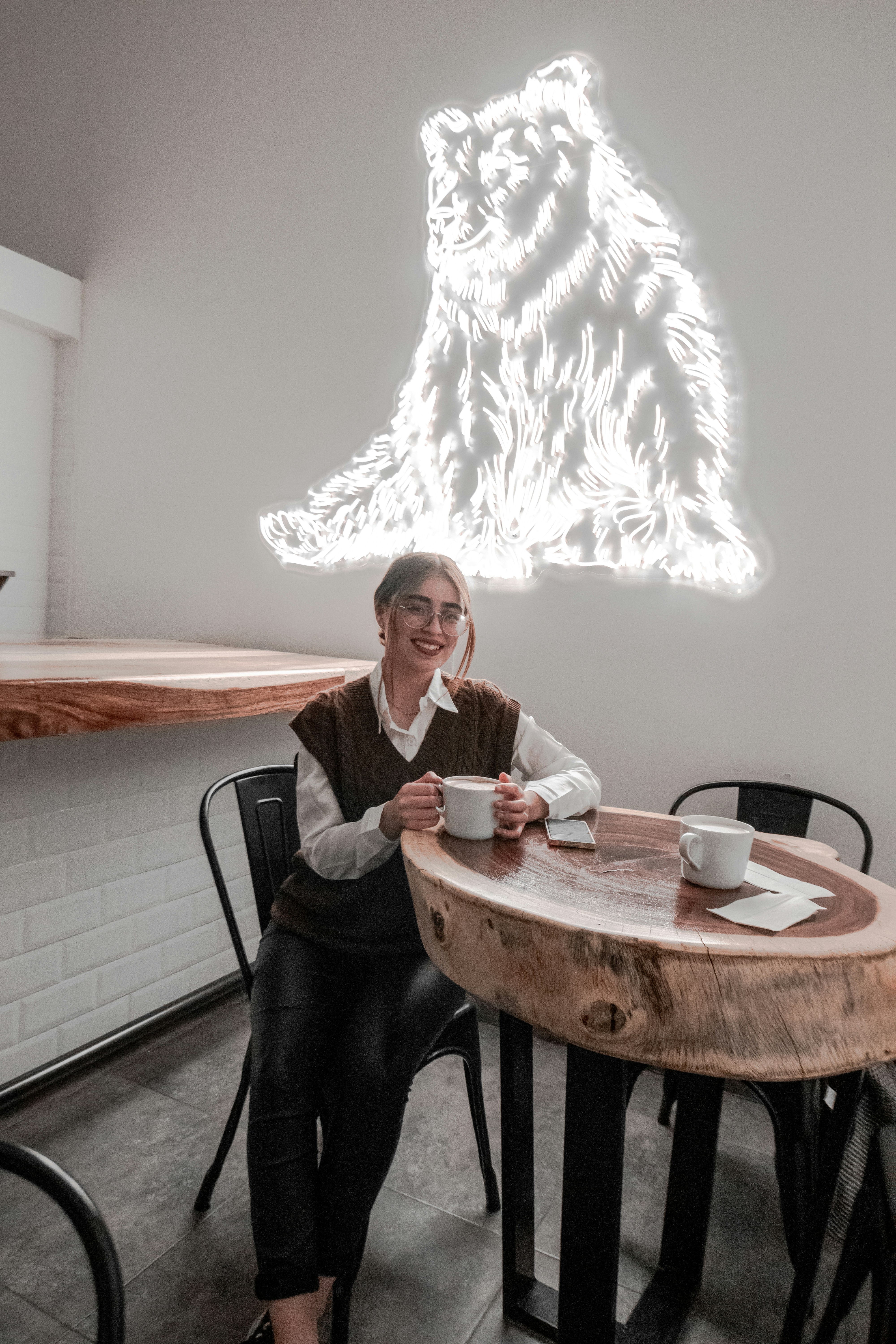 Neon Bear Glow Portrait: Coffee, Light, and a Quiet Smile