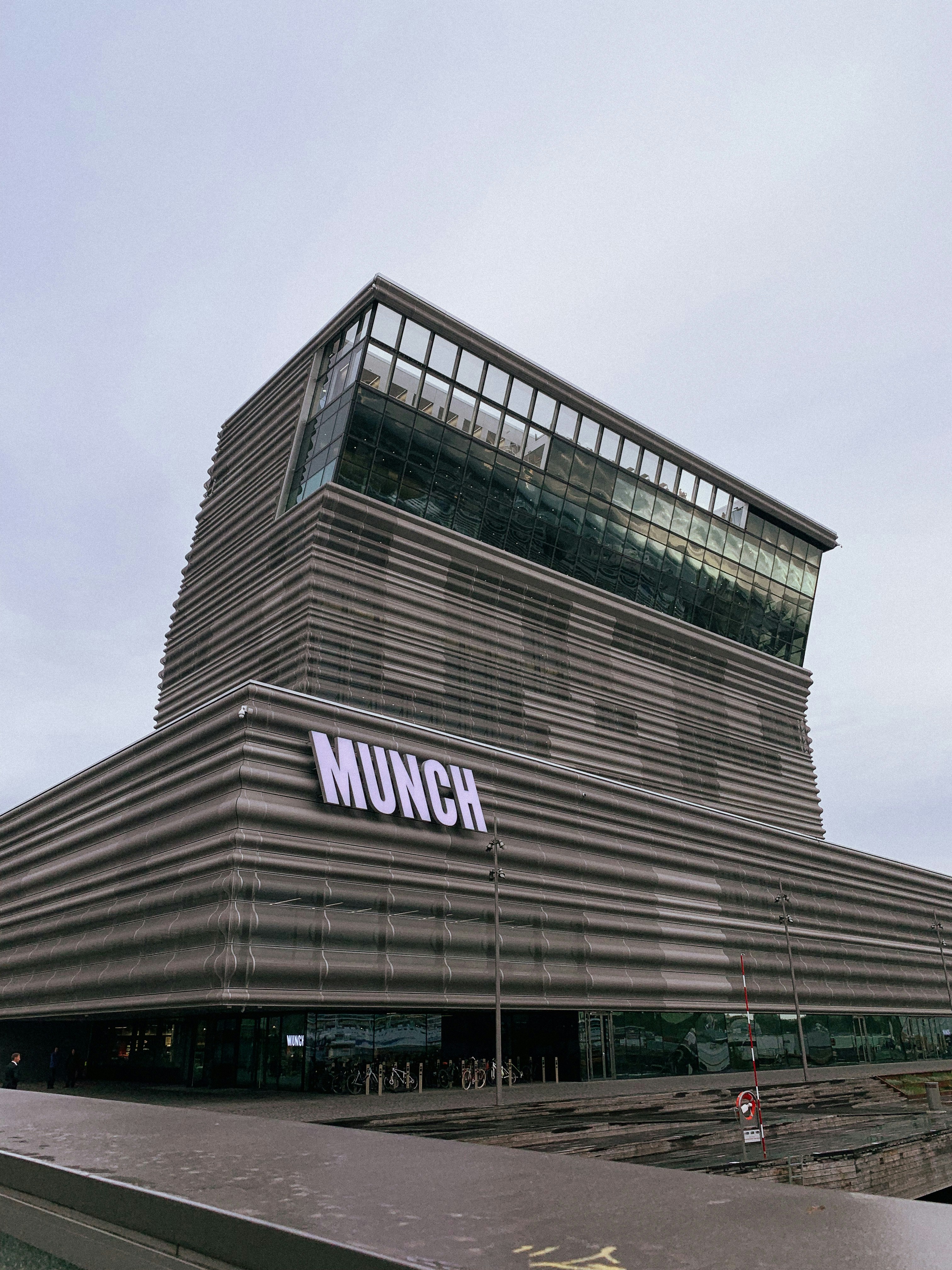 A large building with the word munch on it photo – Free Grey Image on ...