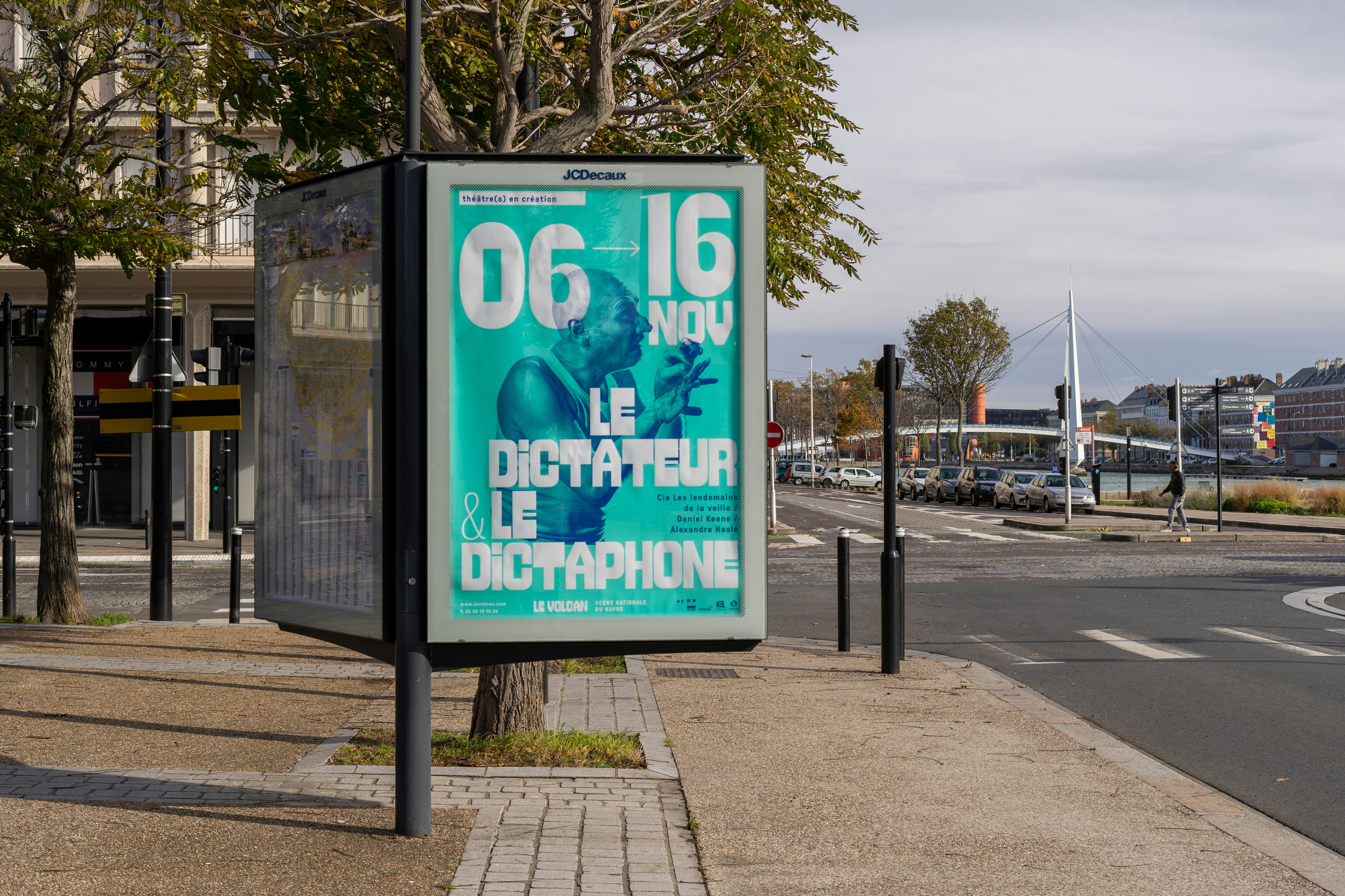 Teal Transit Ad in a Sunlit City Street