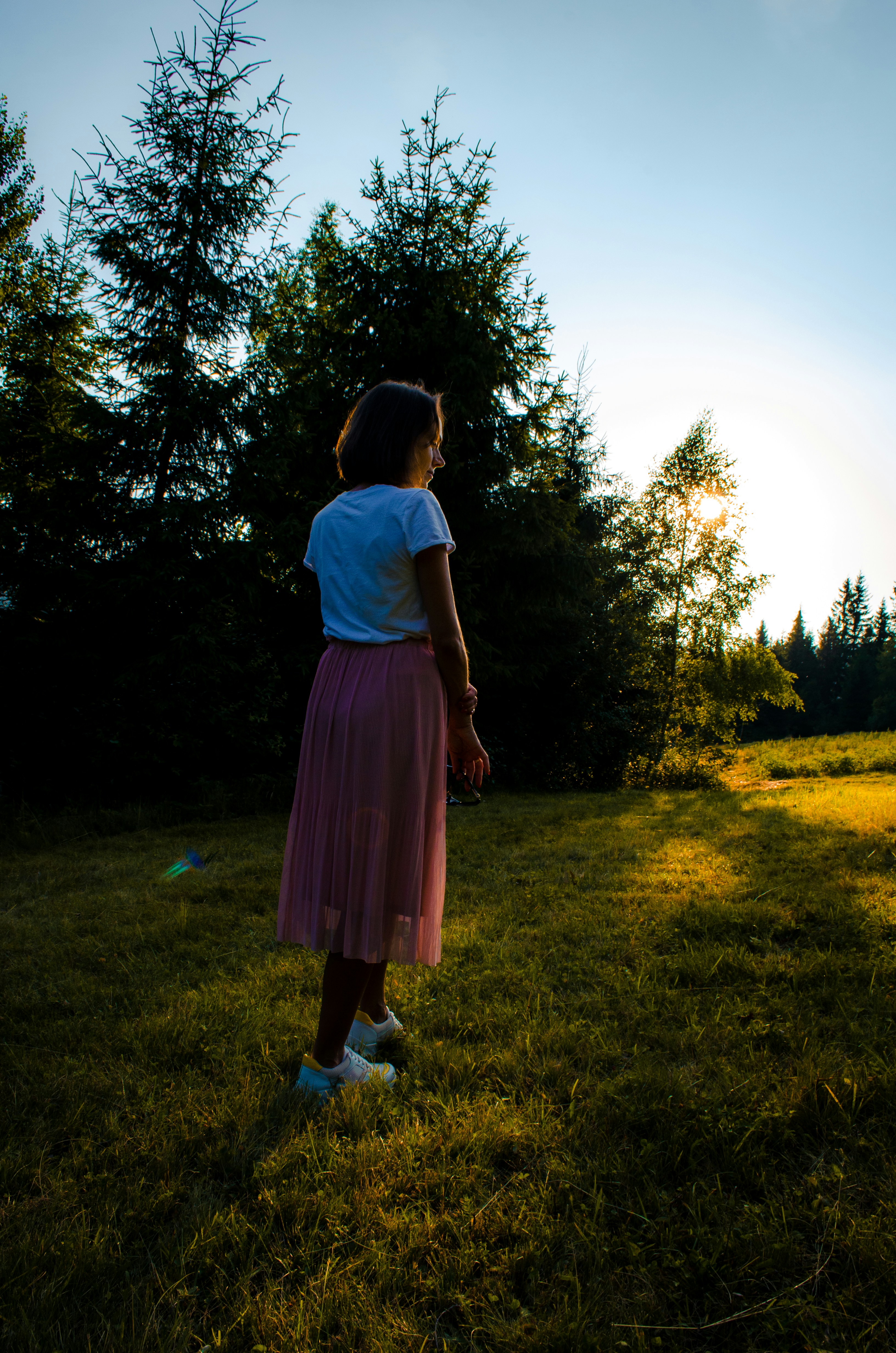 Pink-Skirt Silhouette in a Pine Meadow at Golden Hour