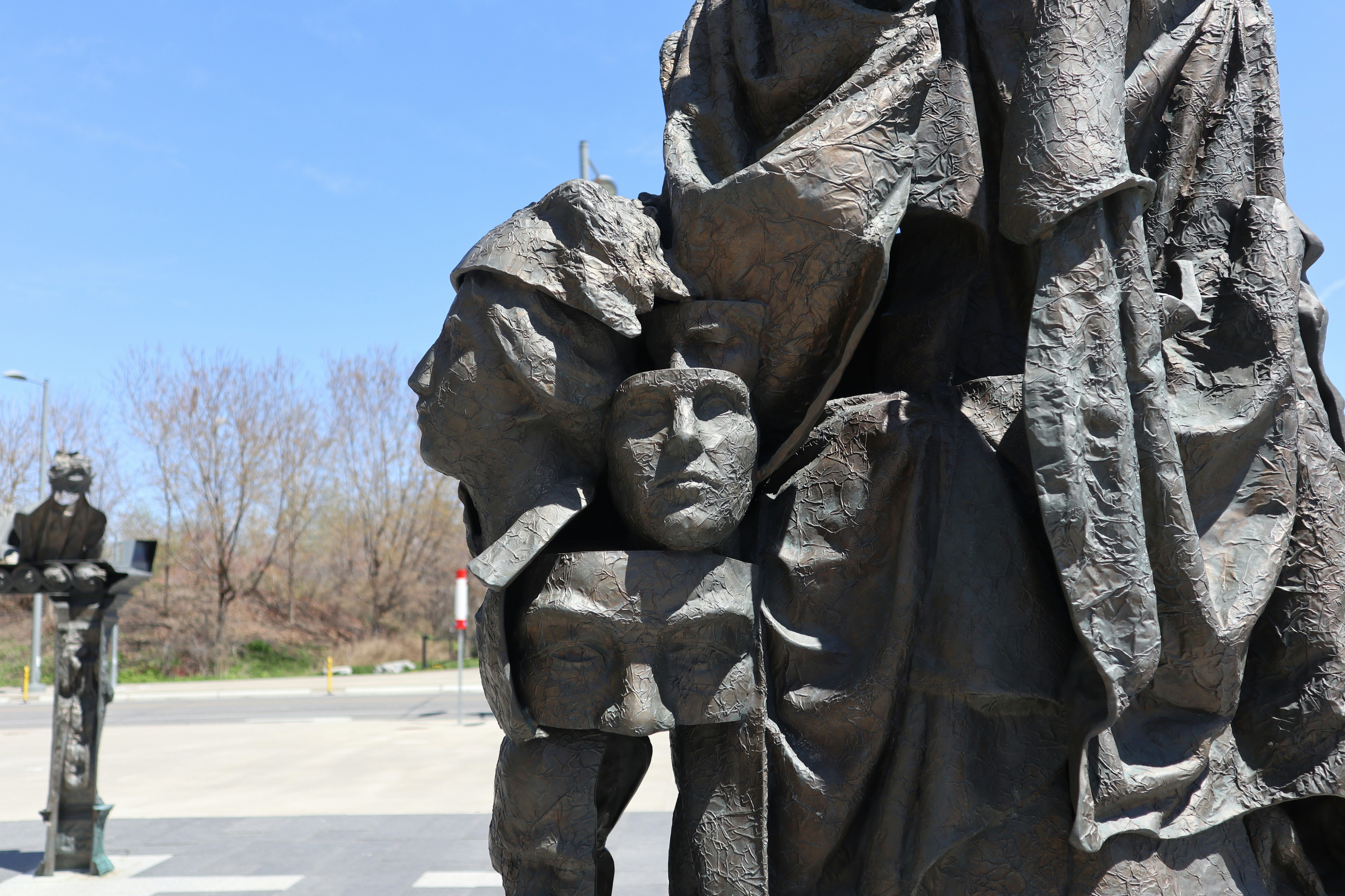 A collage of faces make up an art installation at the corner of Bayview and Front St. East. 