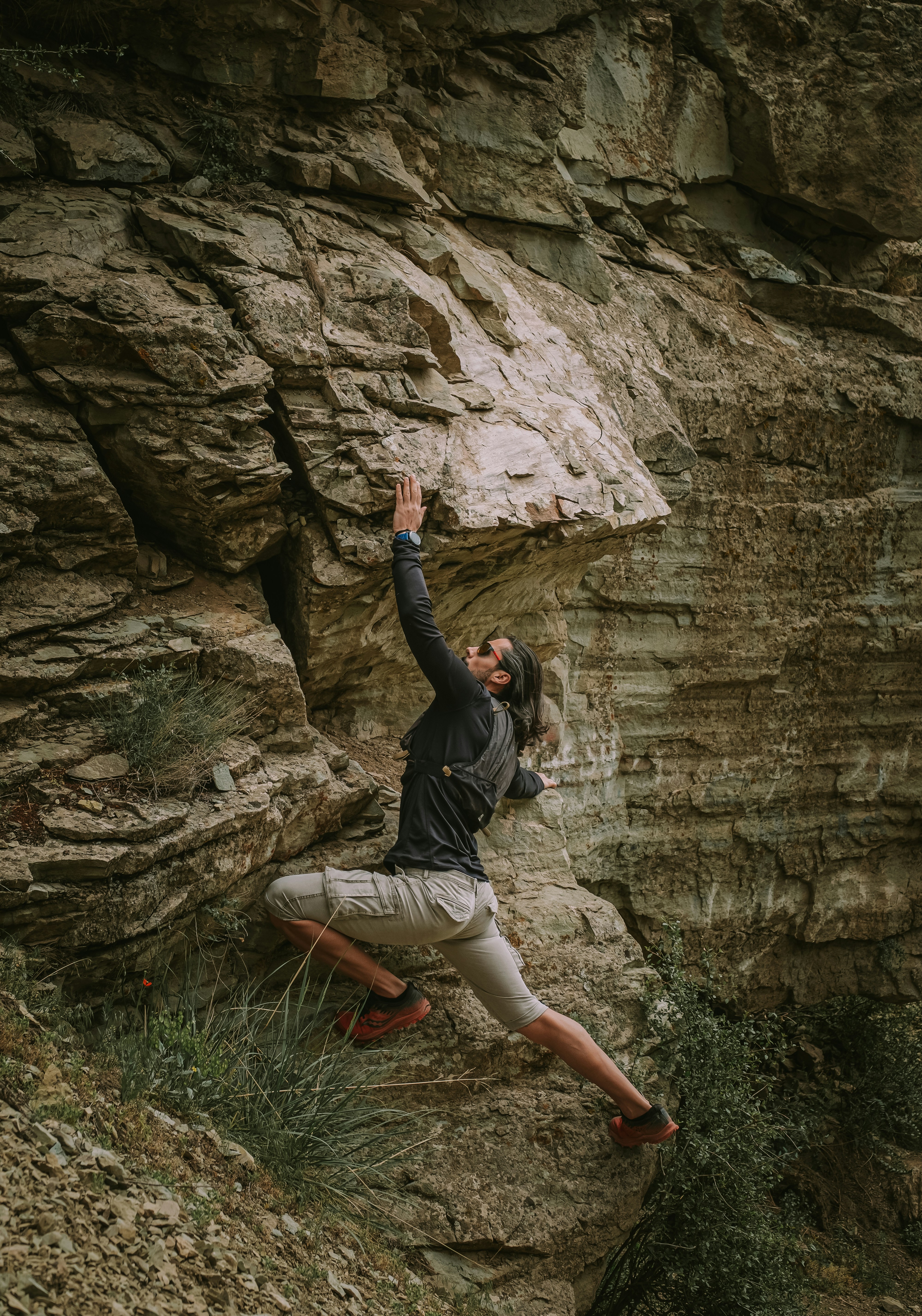Cliffside Ascent: Reaching for the Edge of Rock
