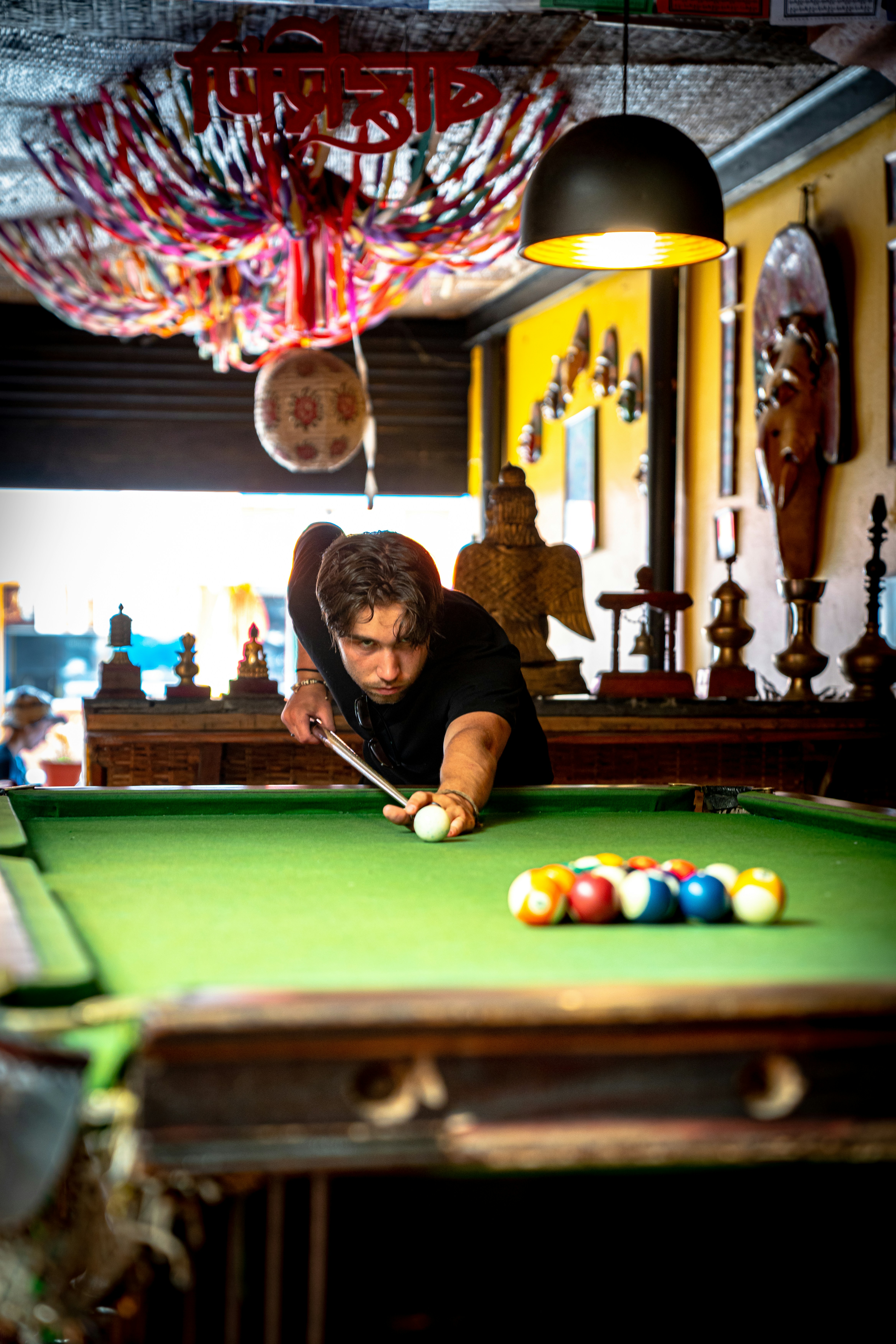 A man leaning over a green pool table photo – Free Pokhara Image on ...
