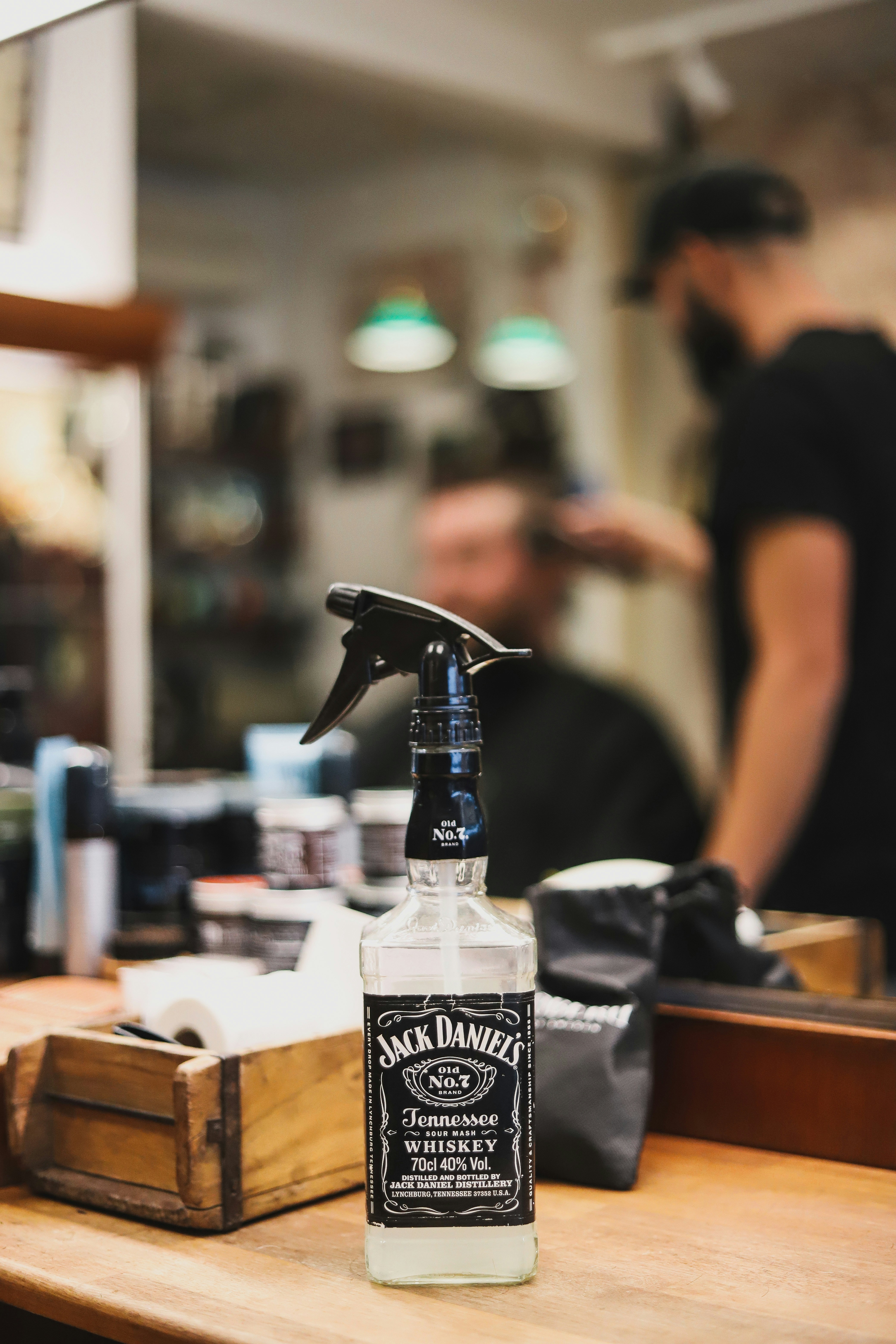 A bottle of jack daniels sitting on a counter photo – Free Silkeborg ...