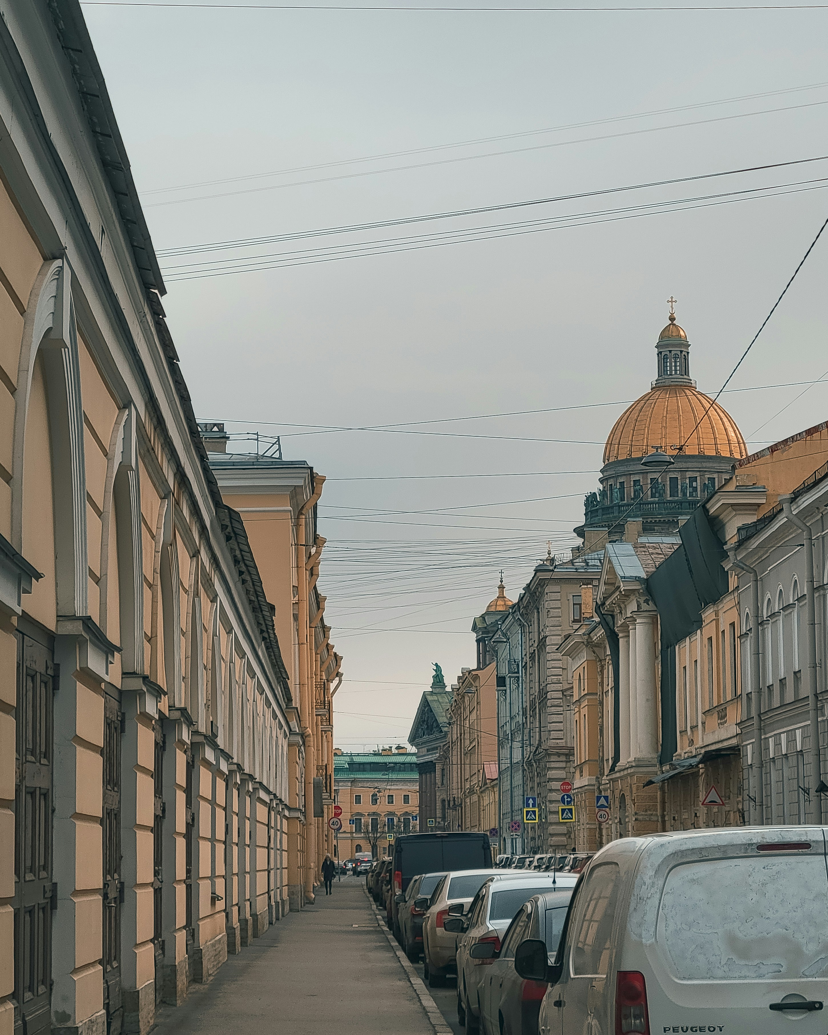 a row of parked cars on a city street