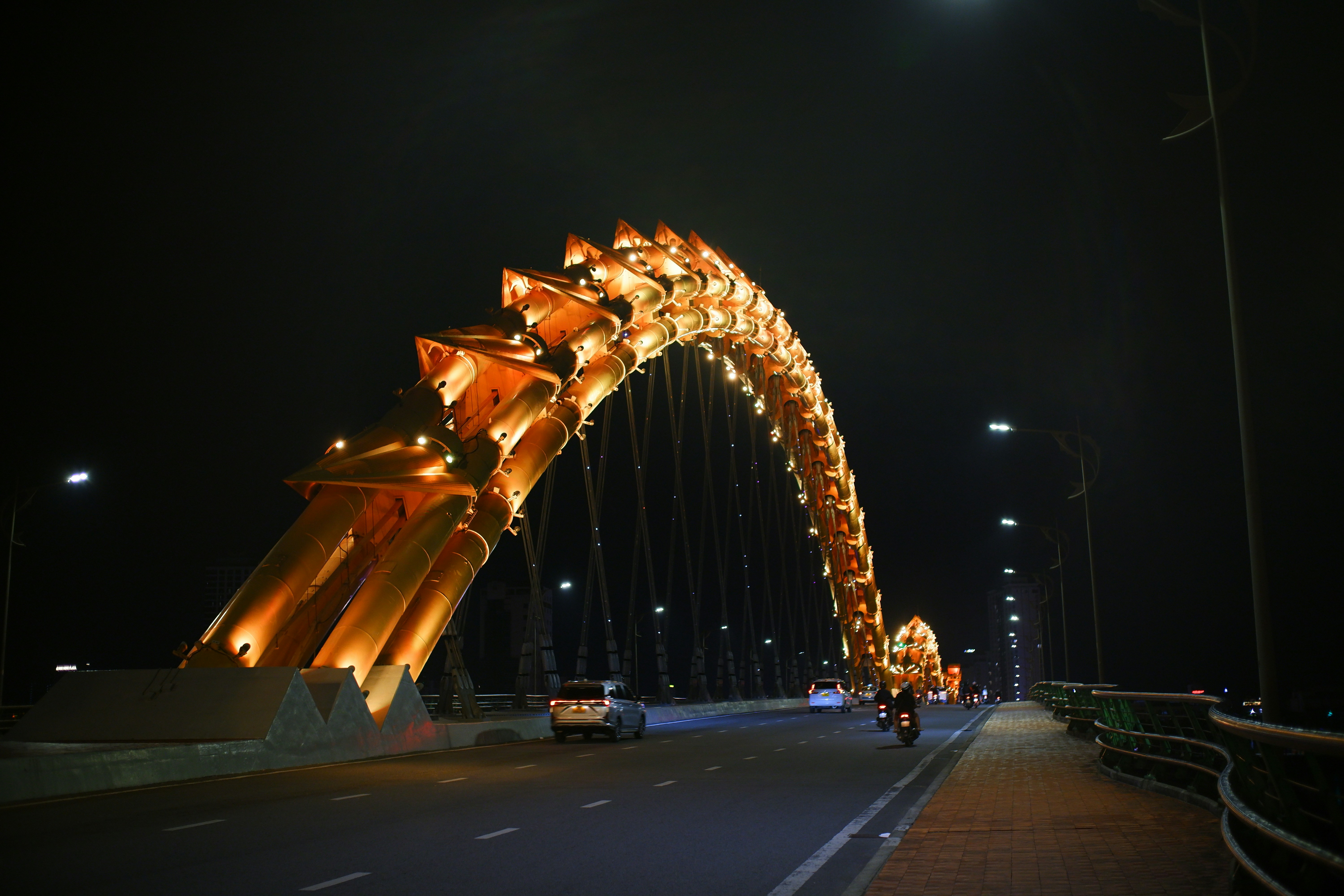 a very tall wooden structure with lights on it's sides