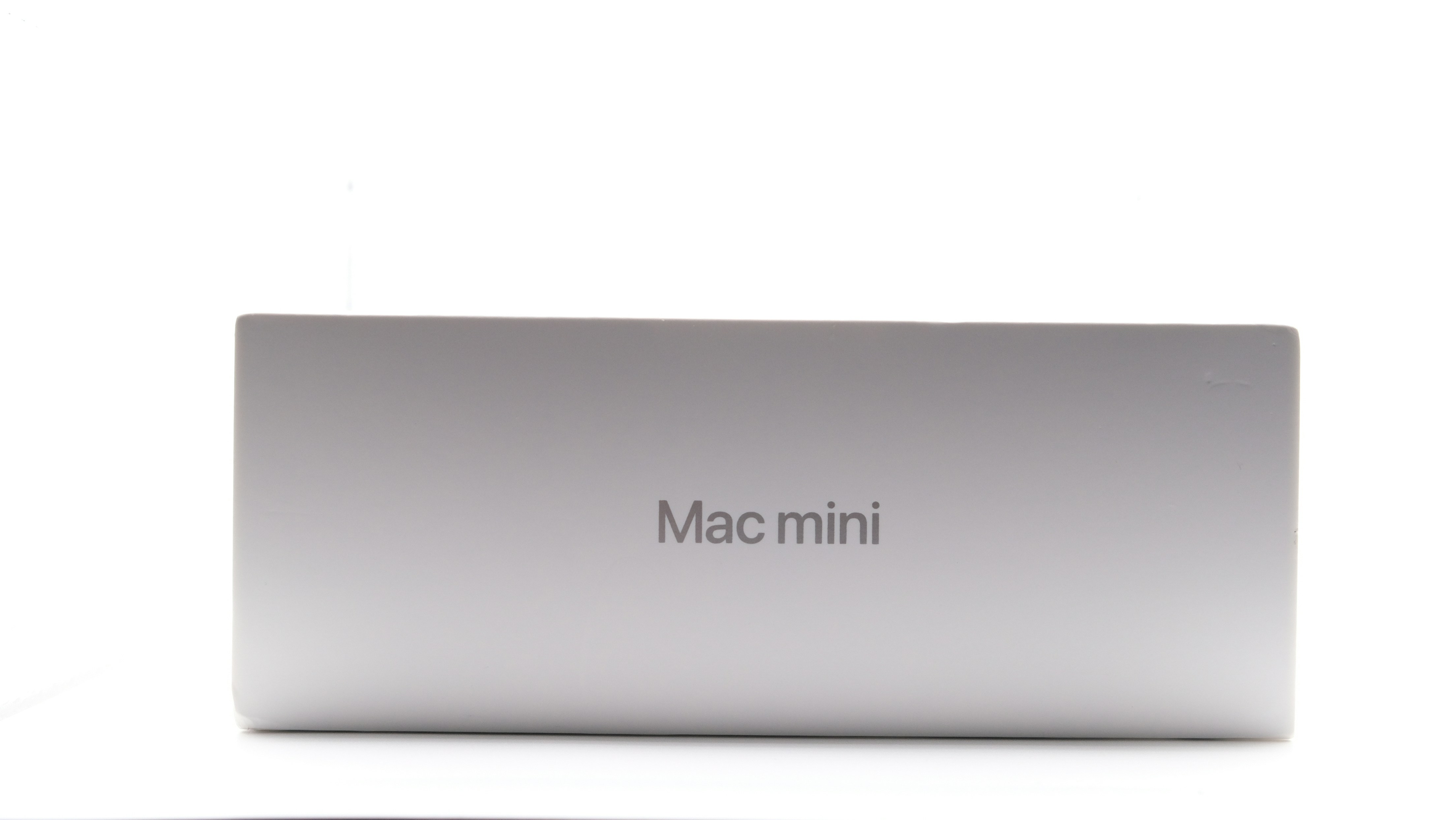 A close up of a mac mini on a white surface photo – Free Macbook Image ...