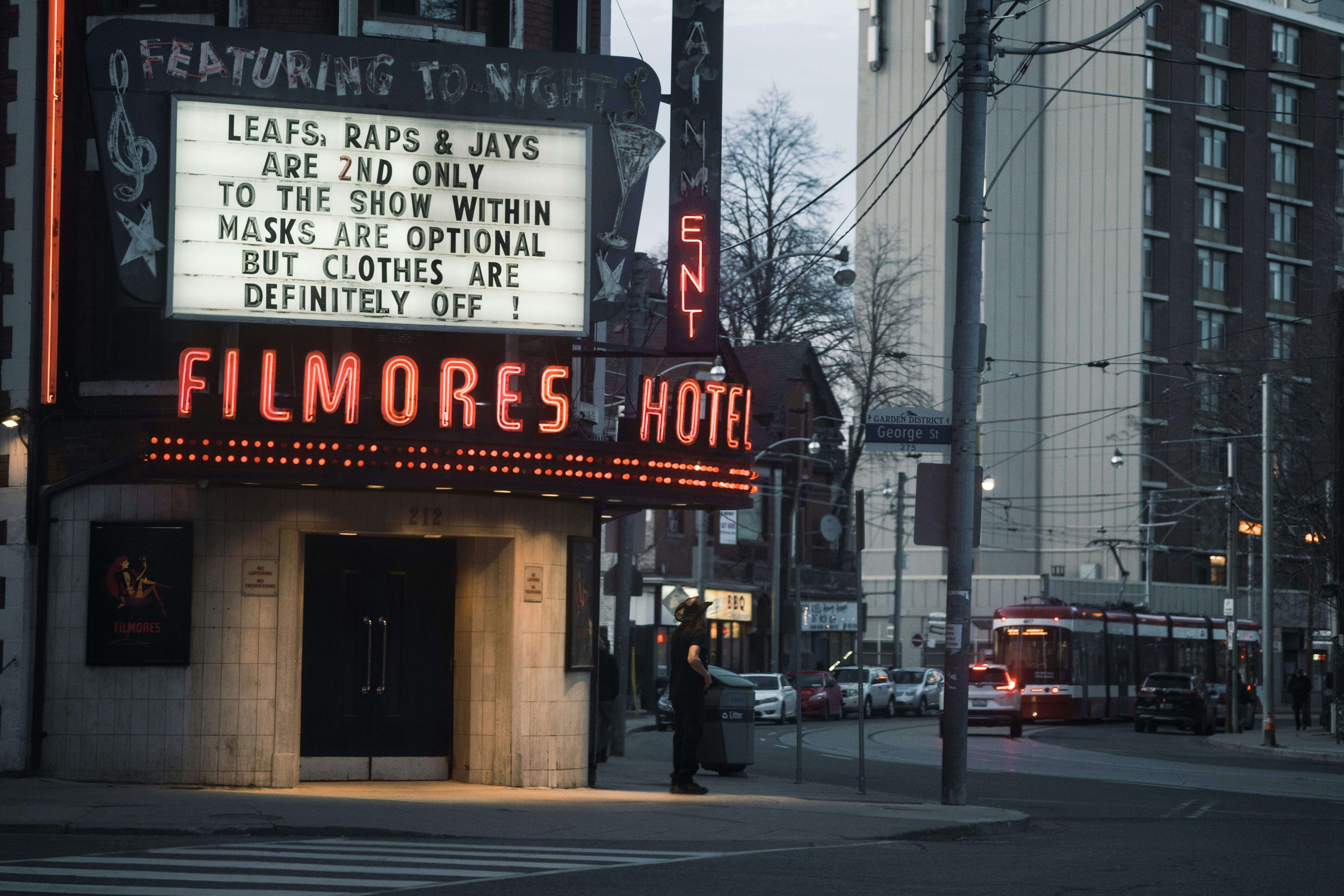 Neon Pulse at Filmore’s Hotel: A Dusk Street Portrait