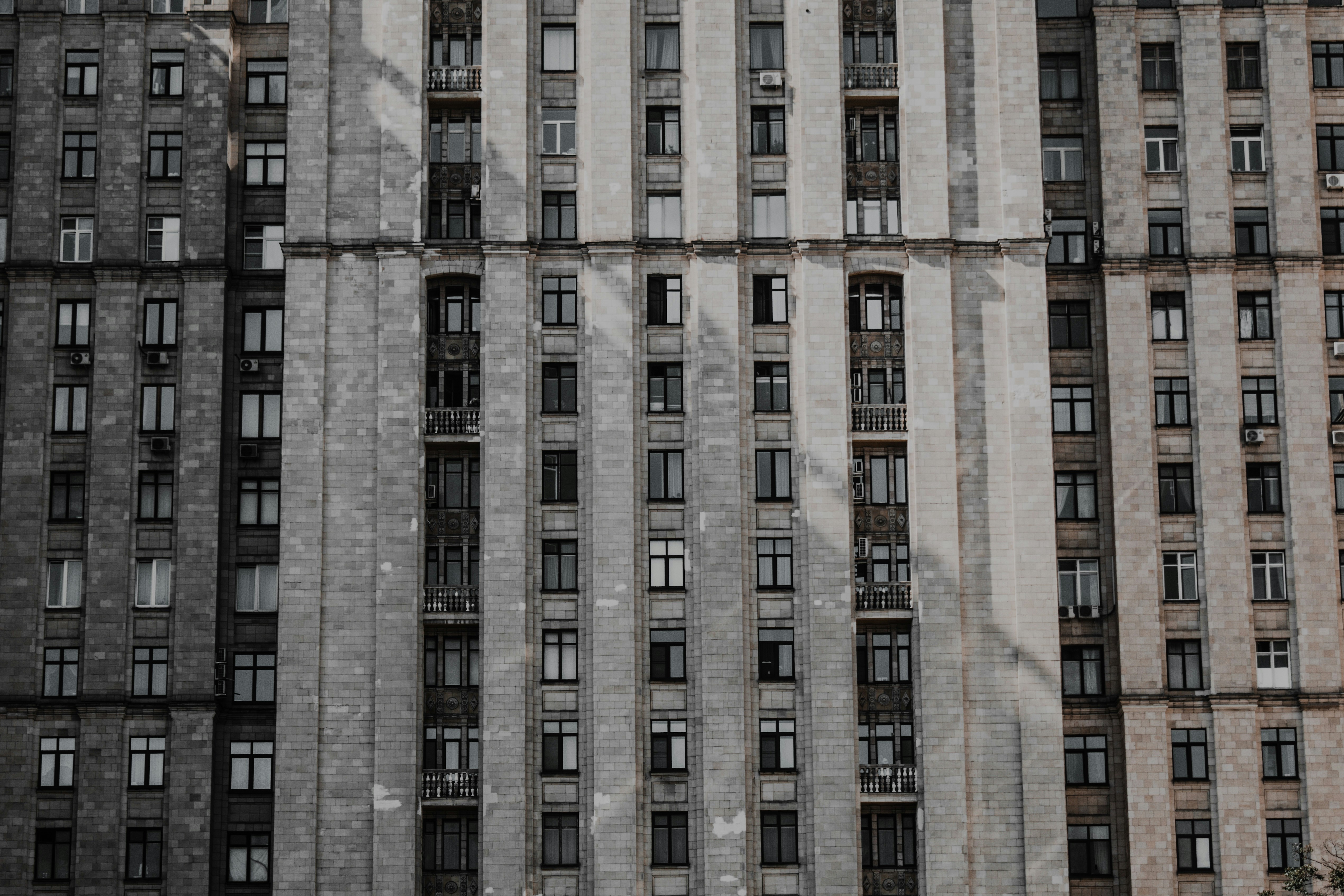 Monochrome Meridian: Vertical Strata on a City Facade