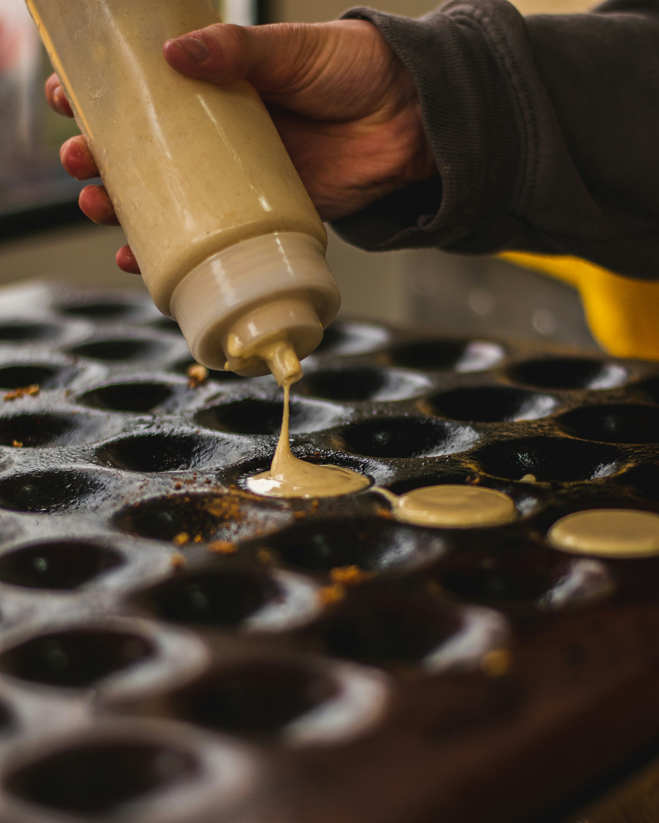 Precision Pour: Batter Dips into Dim Muffin Wells