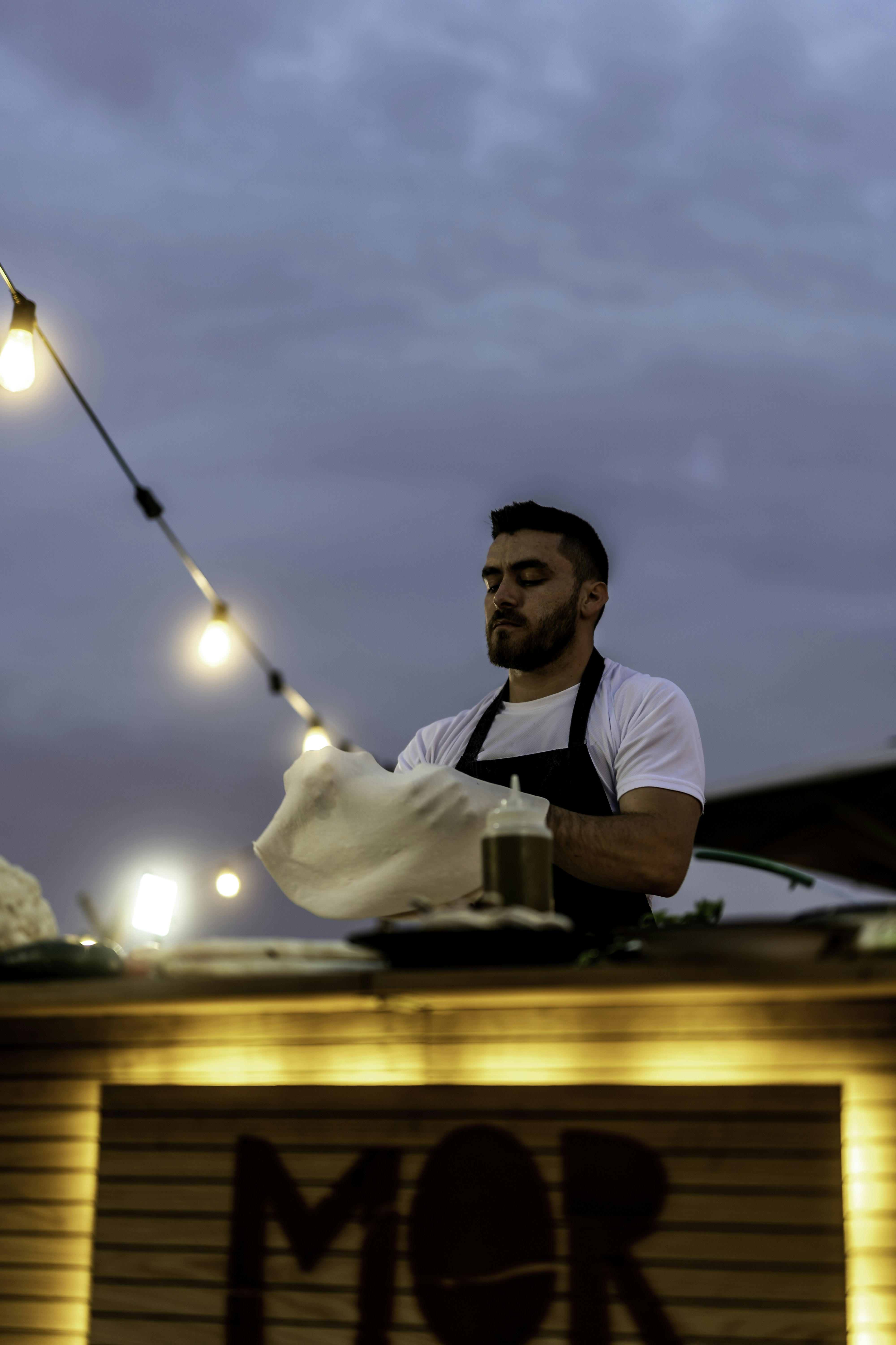 A man standing on top of a roof next to a light photo – Free Human ...