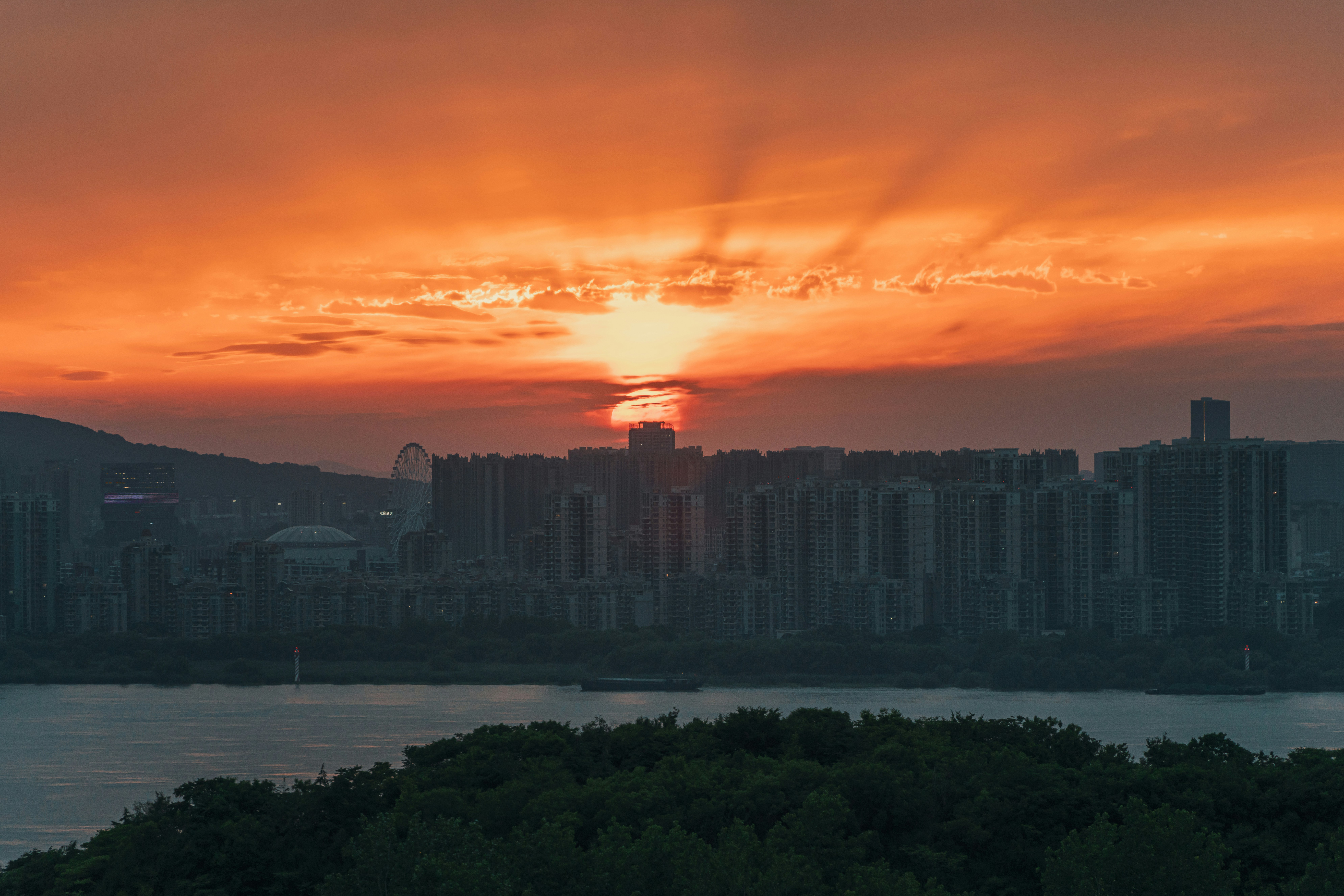 The sun is setting over a large city photo – Free Nature Image on Unsplash