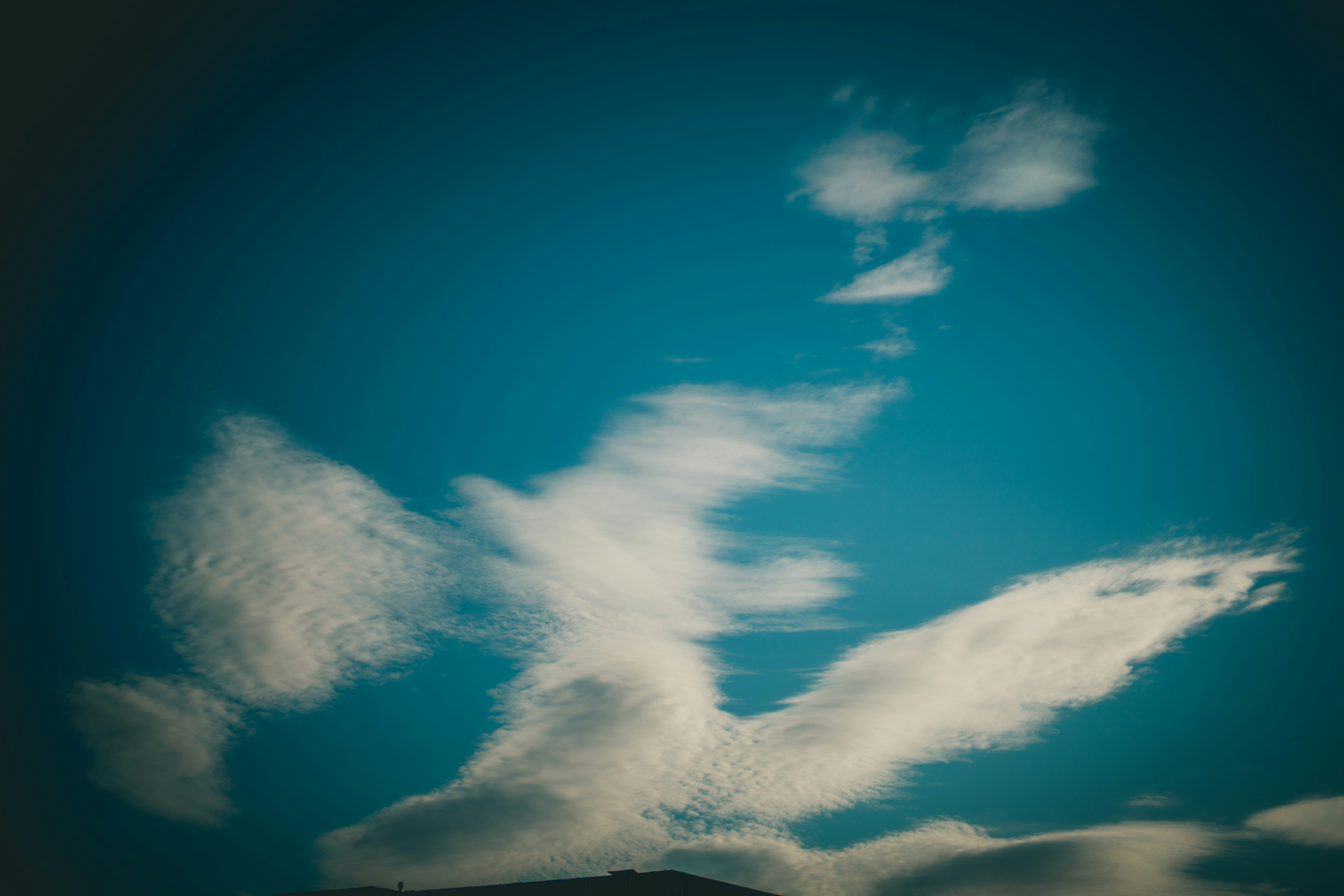 Azure Drift: Cloud Sculptures Across a Quiet Skyline