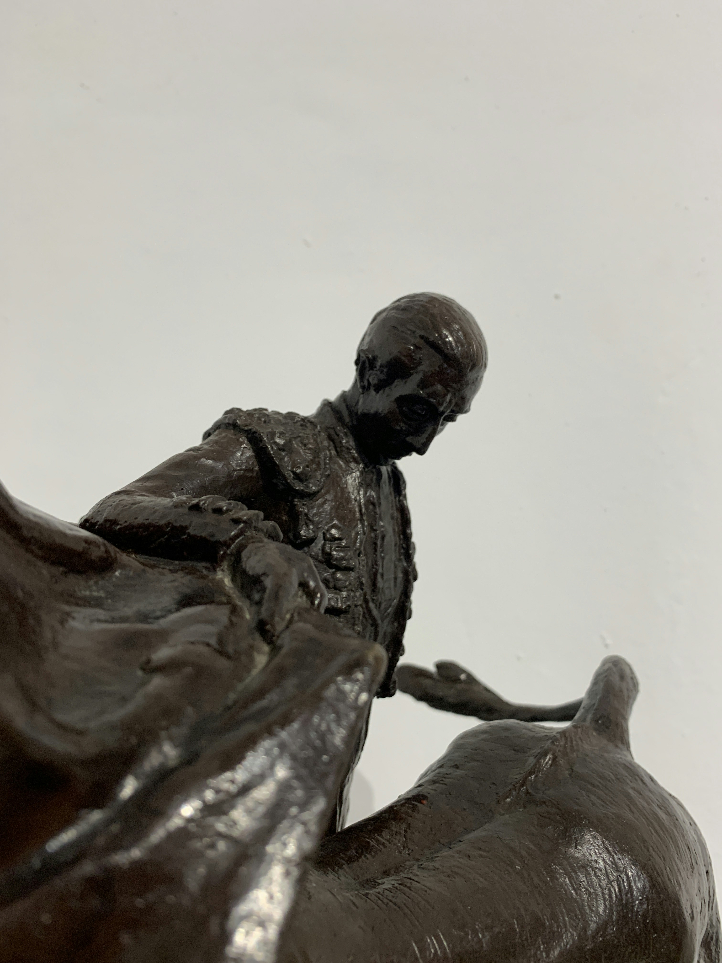 Bronze in Reach: a Low-Angle Portrait of a Reaching Figure