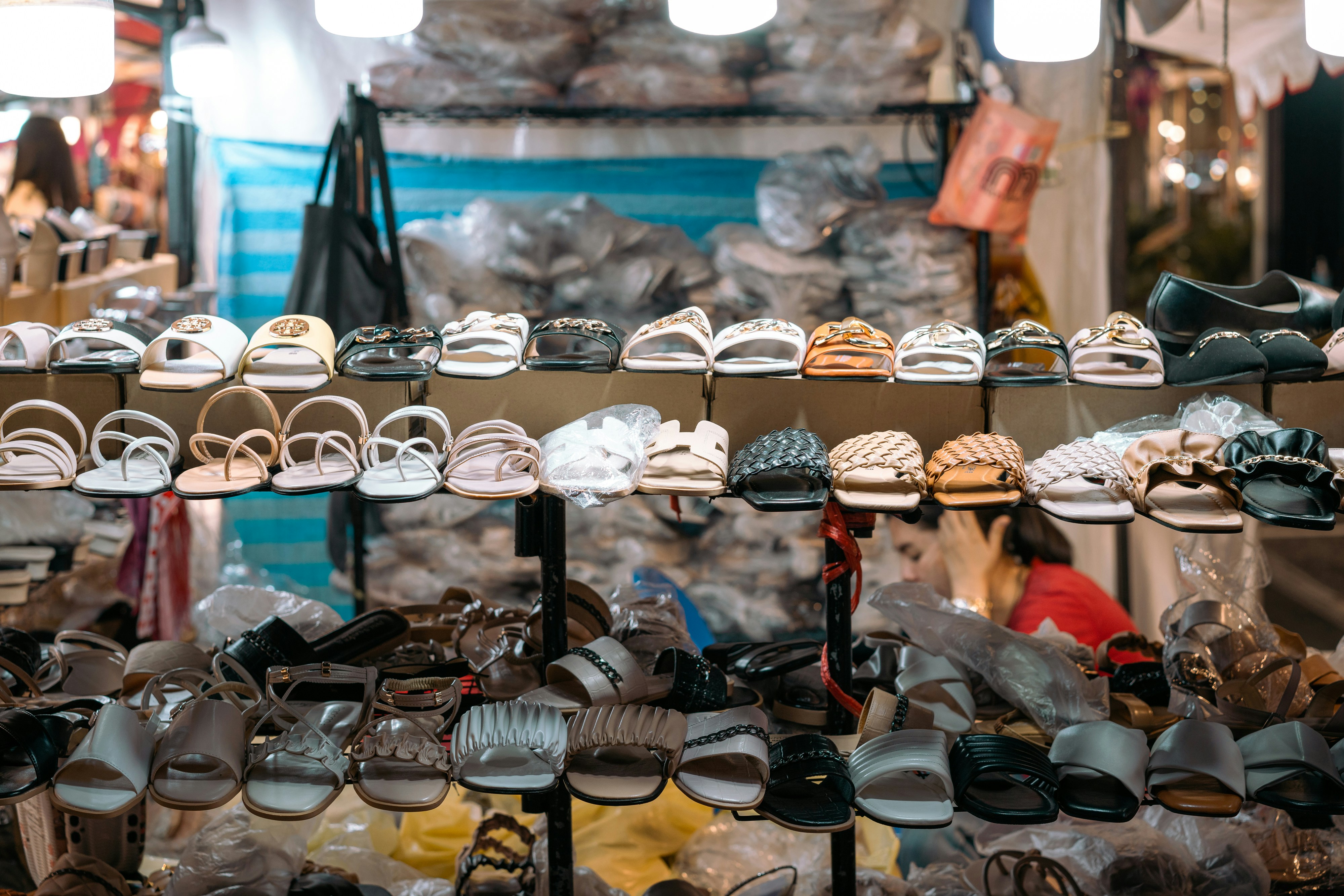 A bunch of shoes that are on a rack photo – Free Bangkok Image on Unsplash