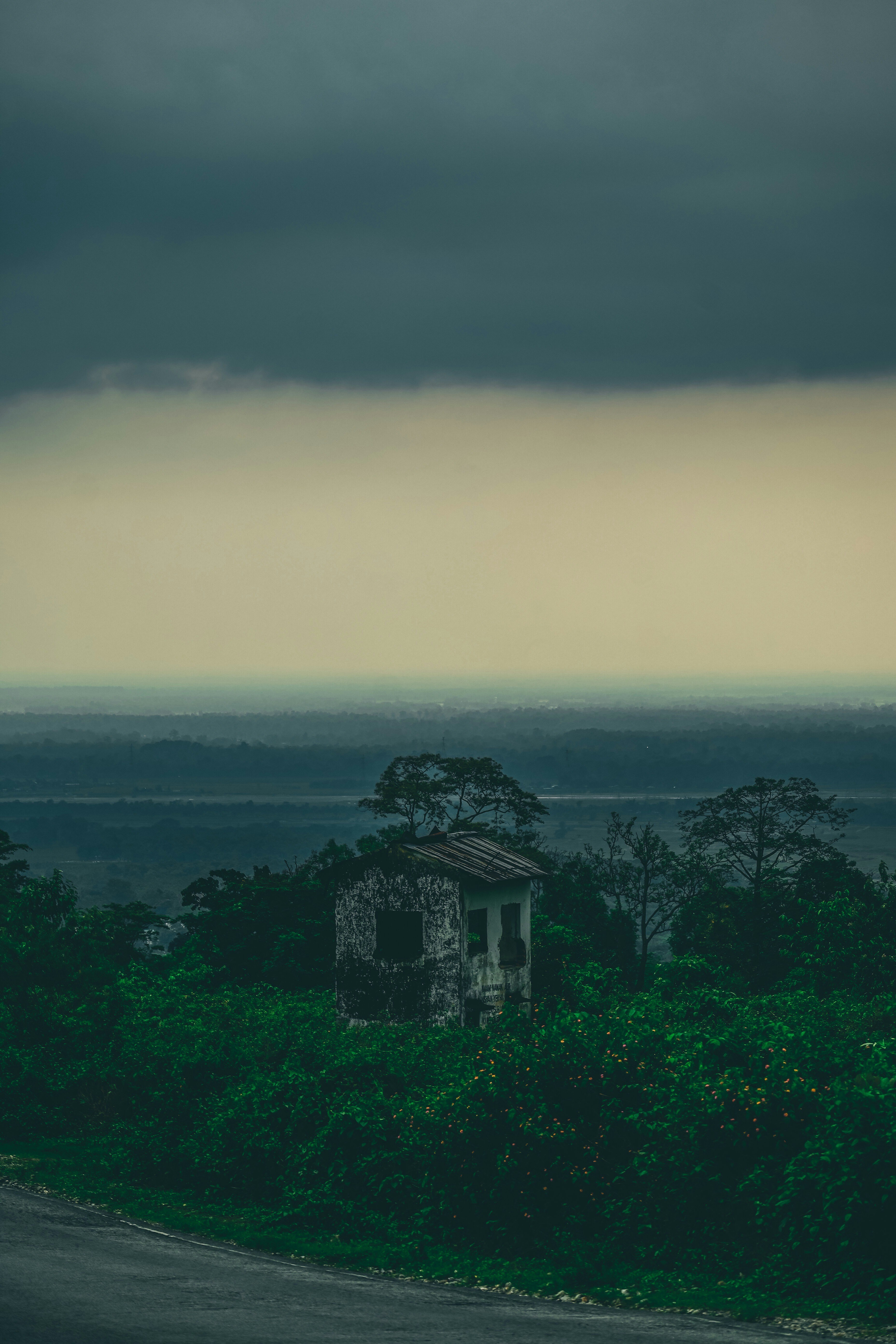 Abandoned Watchtower Amid Verdant Hills at Dusk