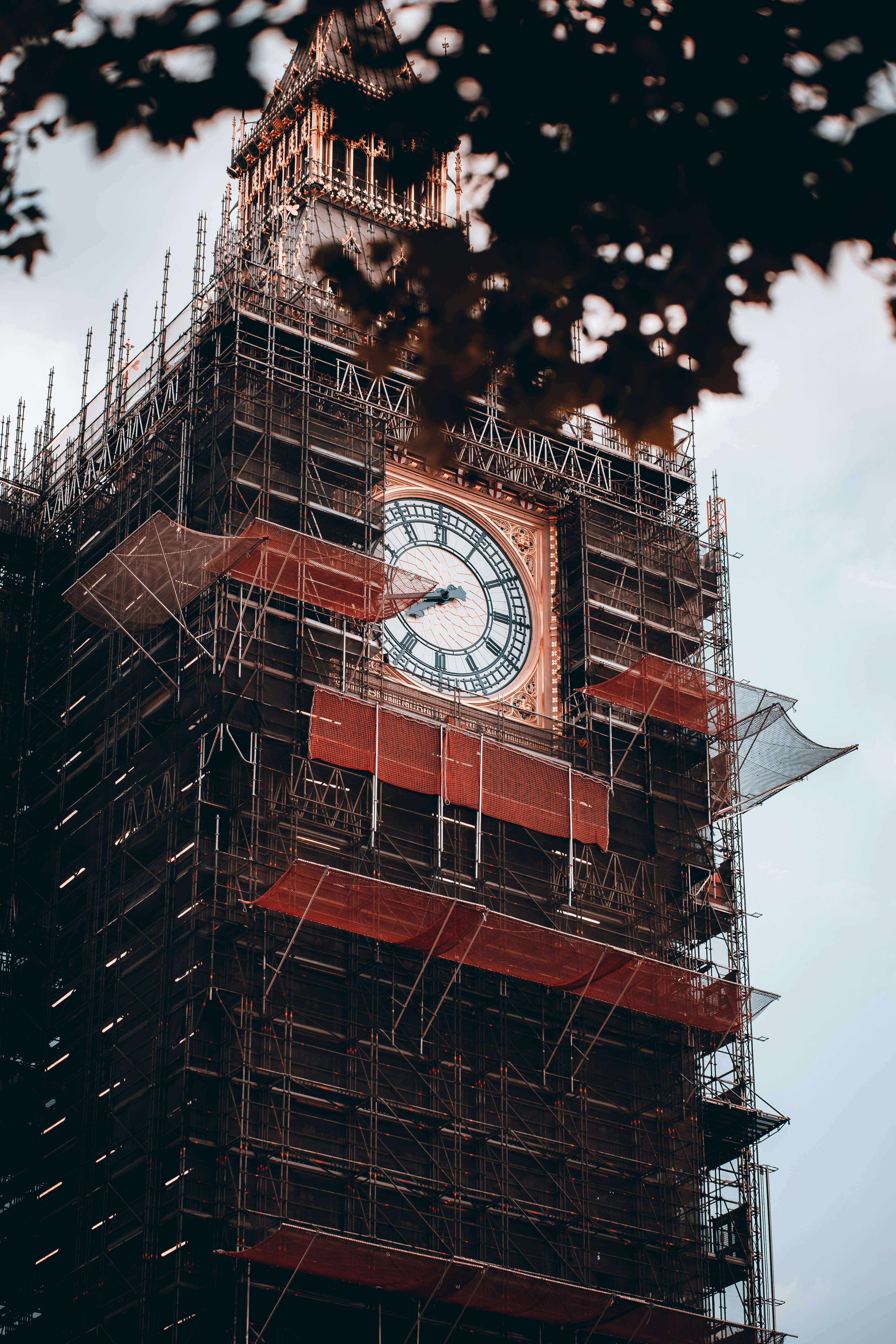 A large clock tower with scaffolding around it photo – Free ...