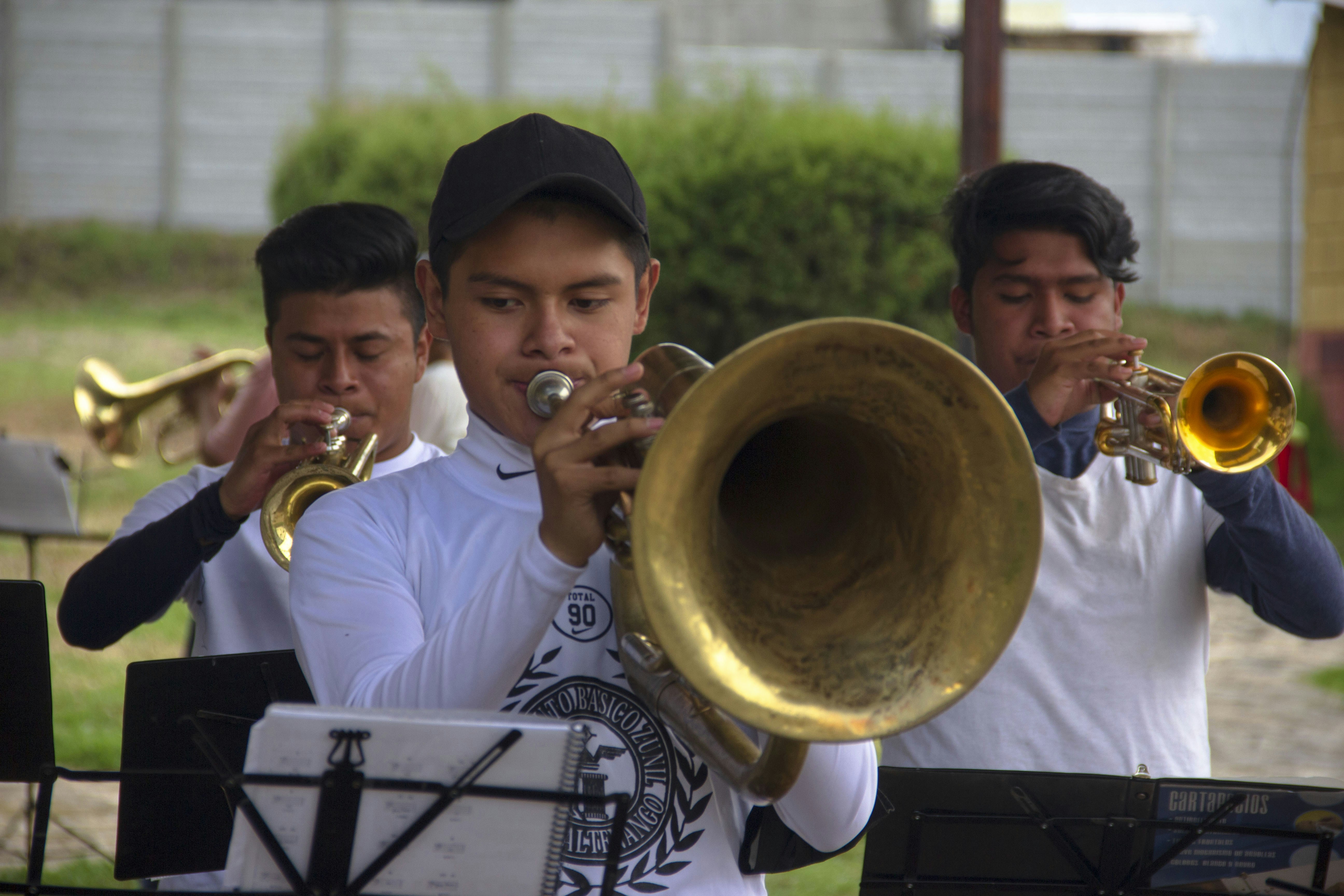 A group of young men playing musical instruments photo – Free Guatemala ...
