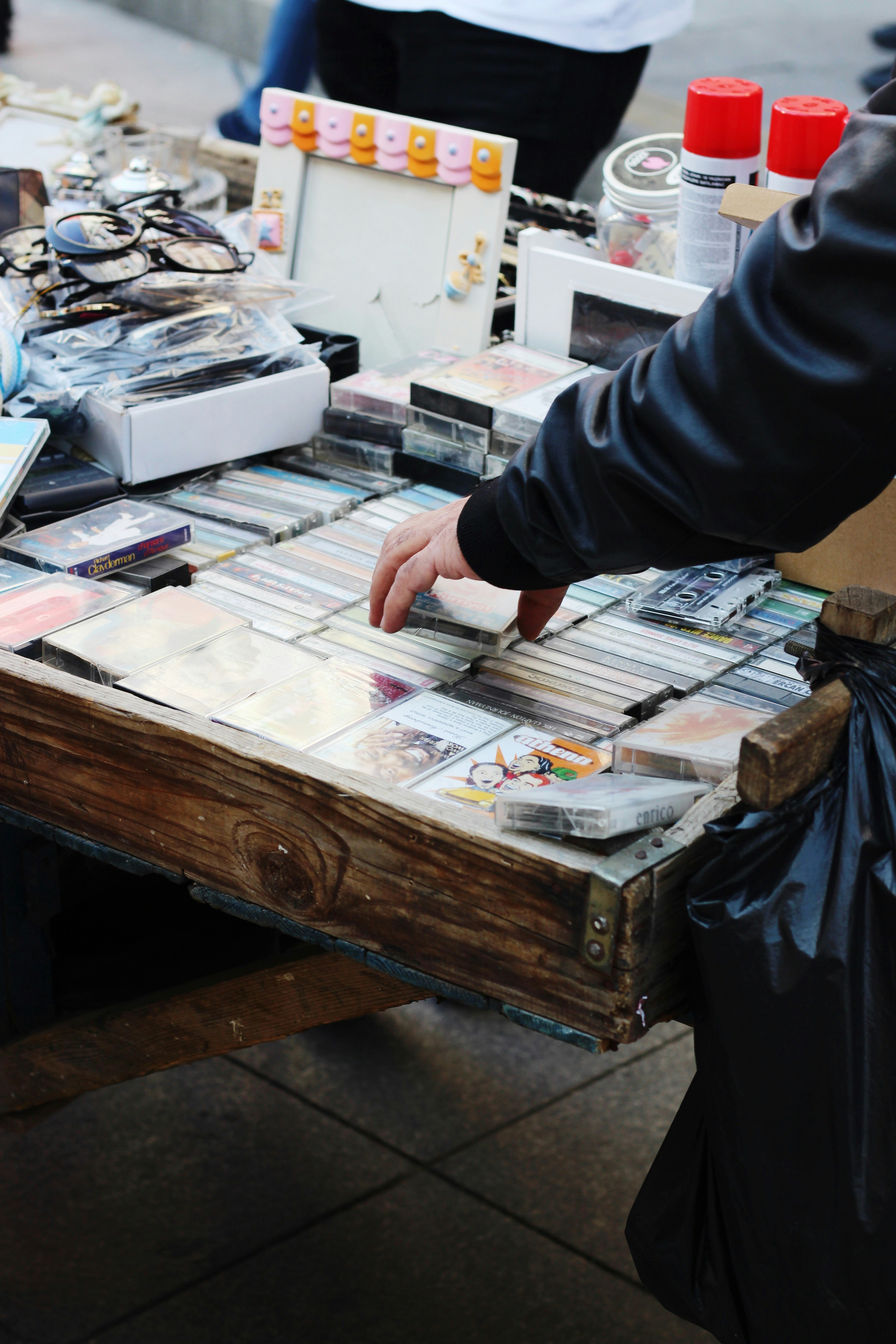 A table with a bunch of cds on it photo – Free Grey Image on Unsplash