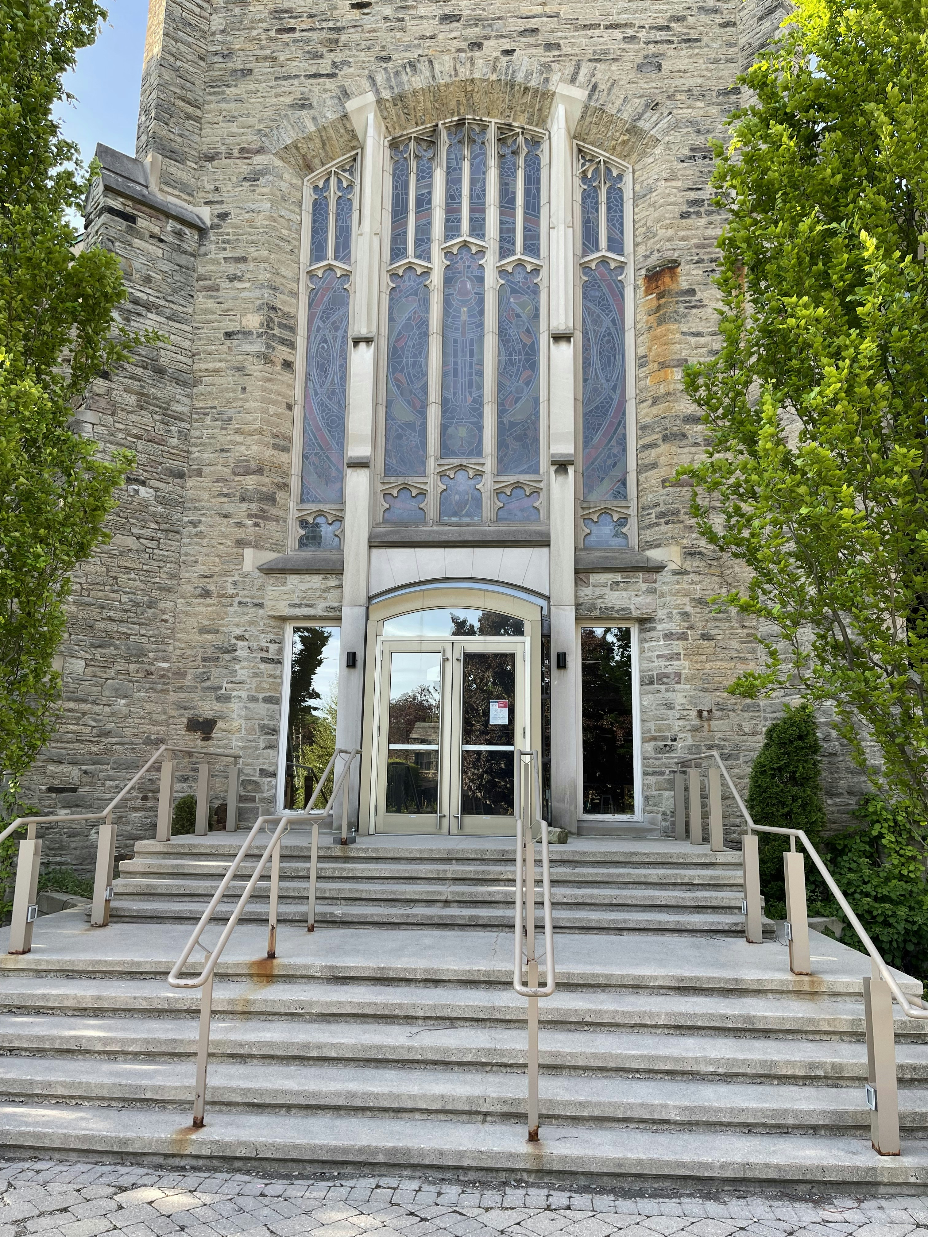 a large stone building with stairs leading up to it