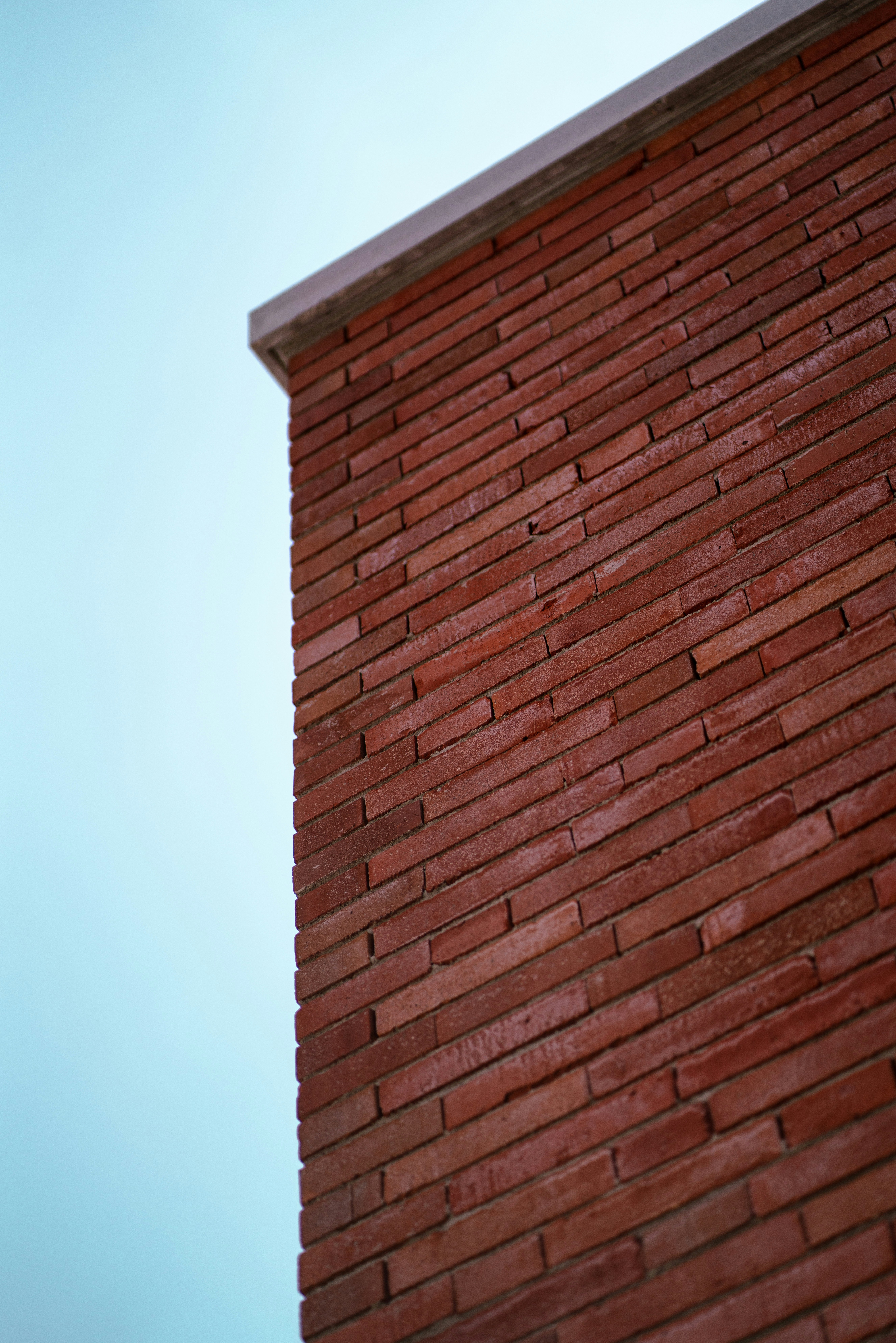 a brick building with a clock on the side of it