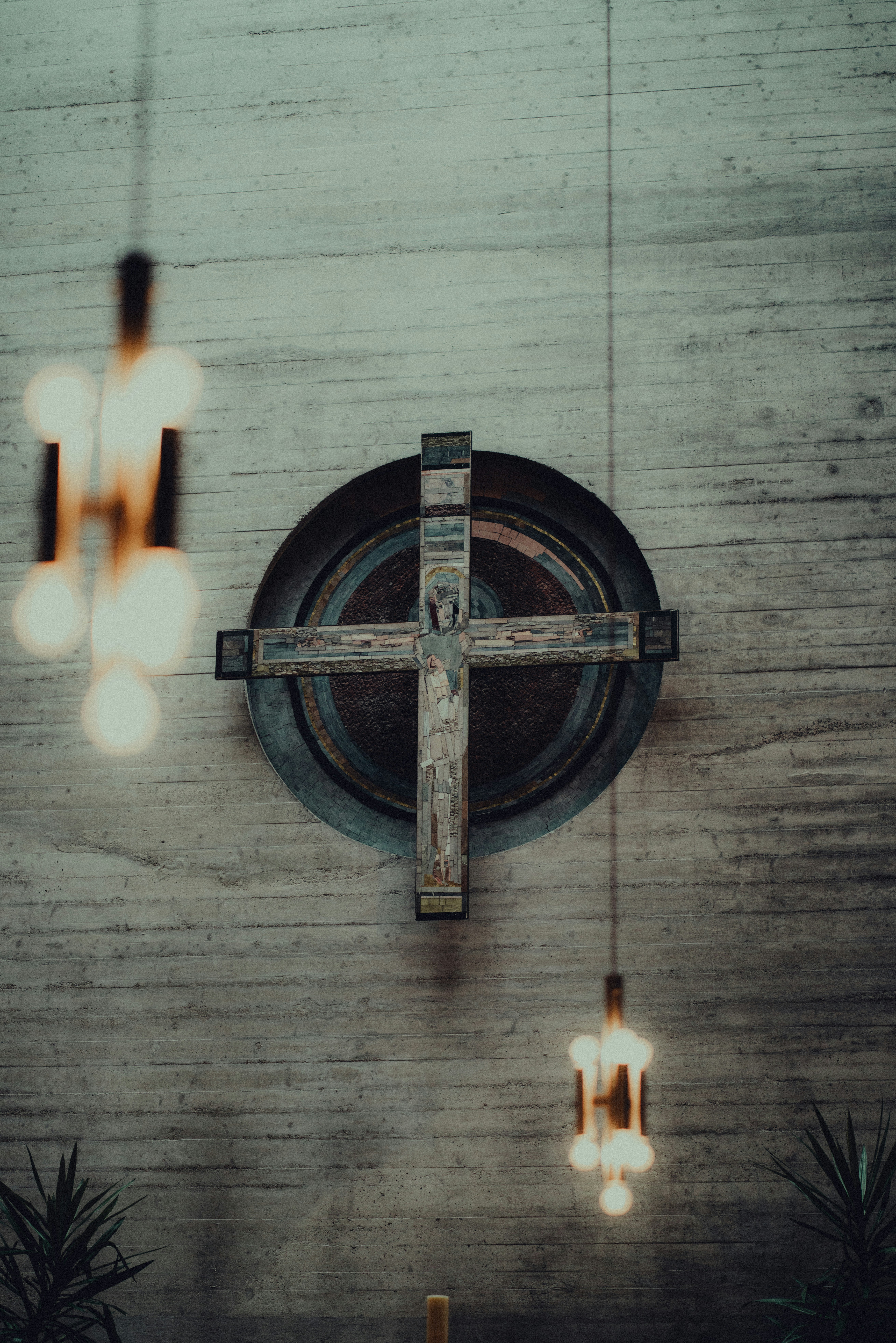 Centerpiece Cross over a Circular Window in a Concrete Sanctuary