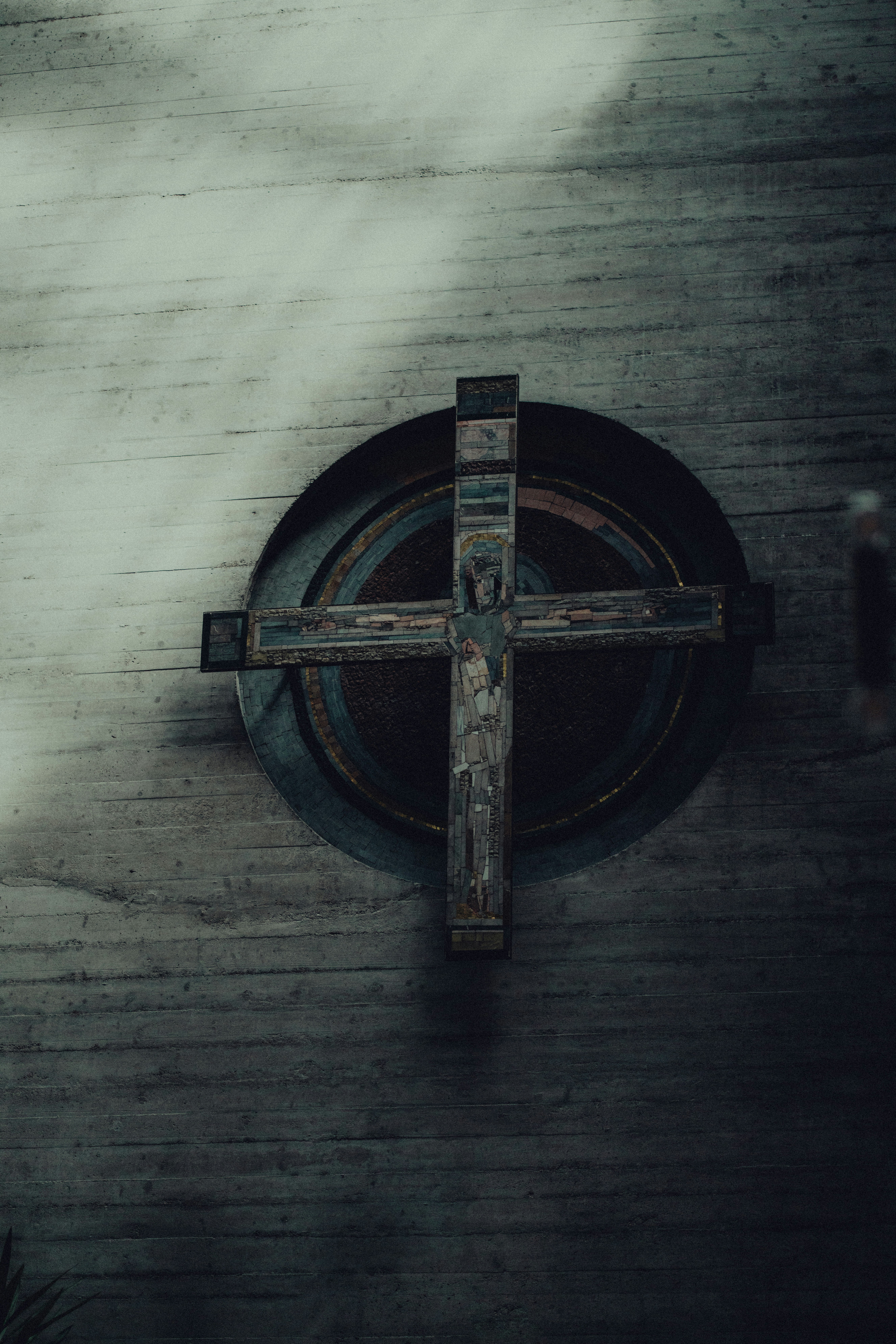 Weathered Cross Over a Circular Hatch: Quiet Light in a Concrete Vault