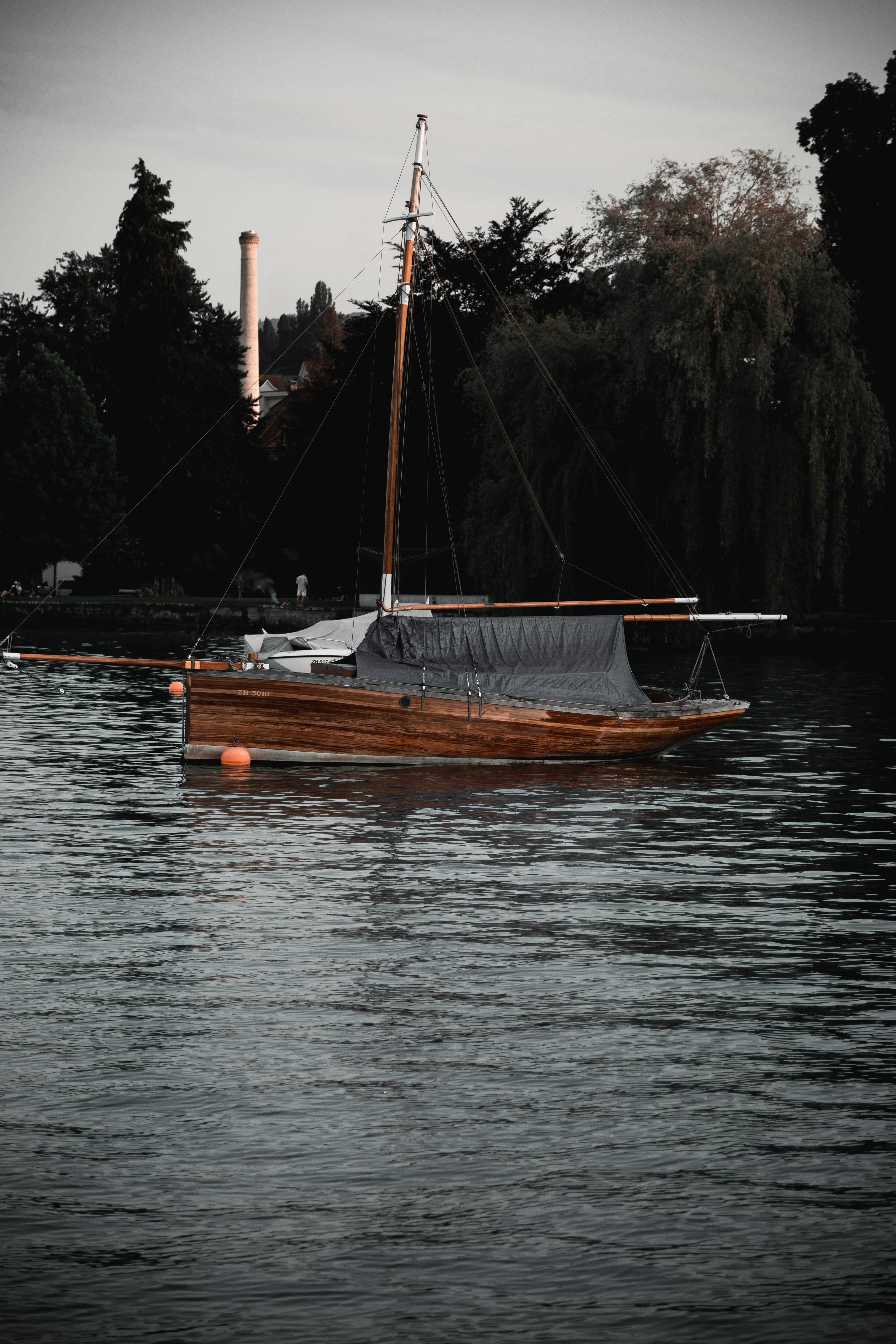 Timber Sloop at Dusk: A Quiet Moor on a Mirror Lake