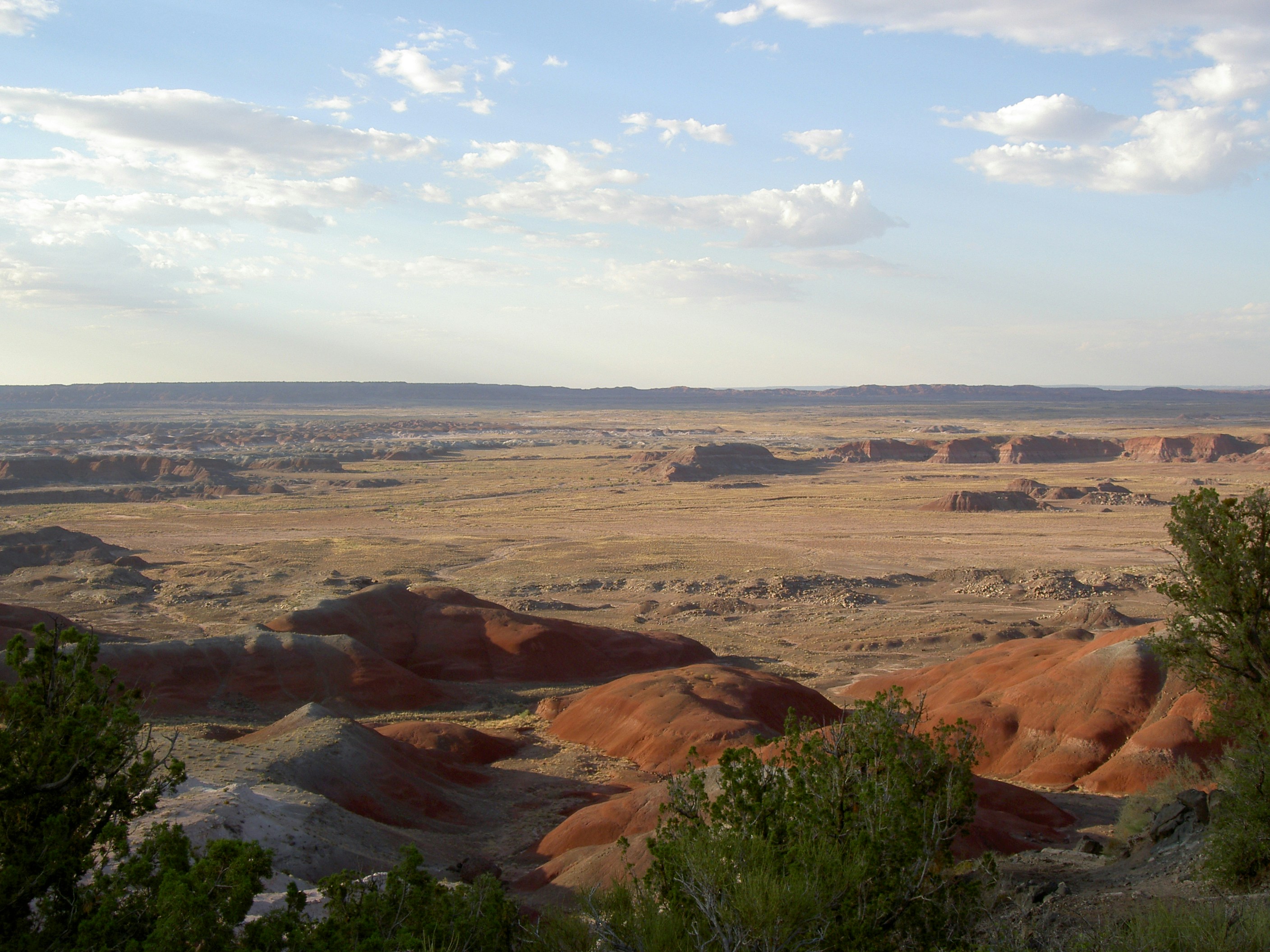 a view of the desert from the top of a hill