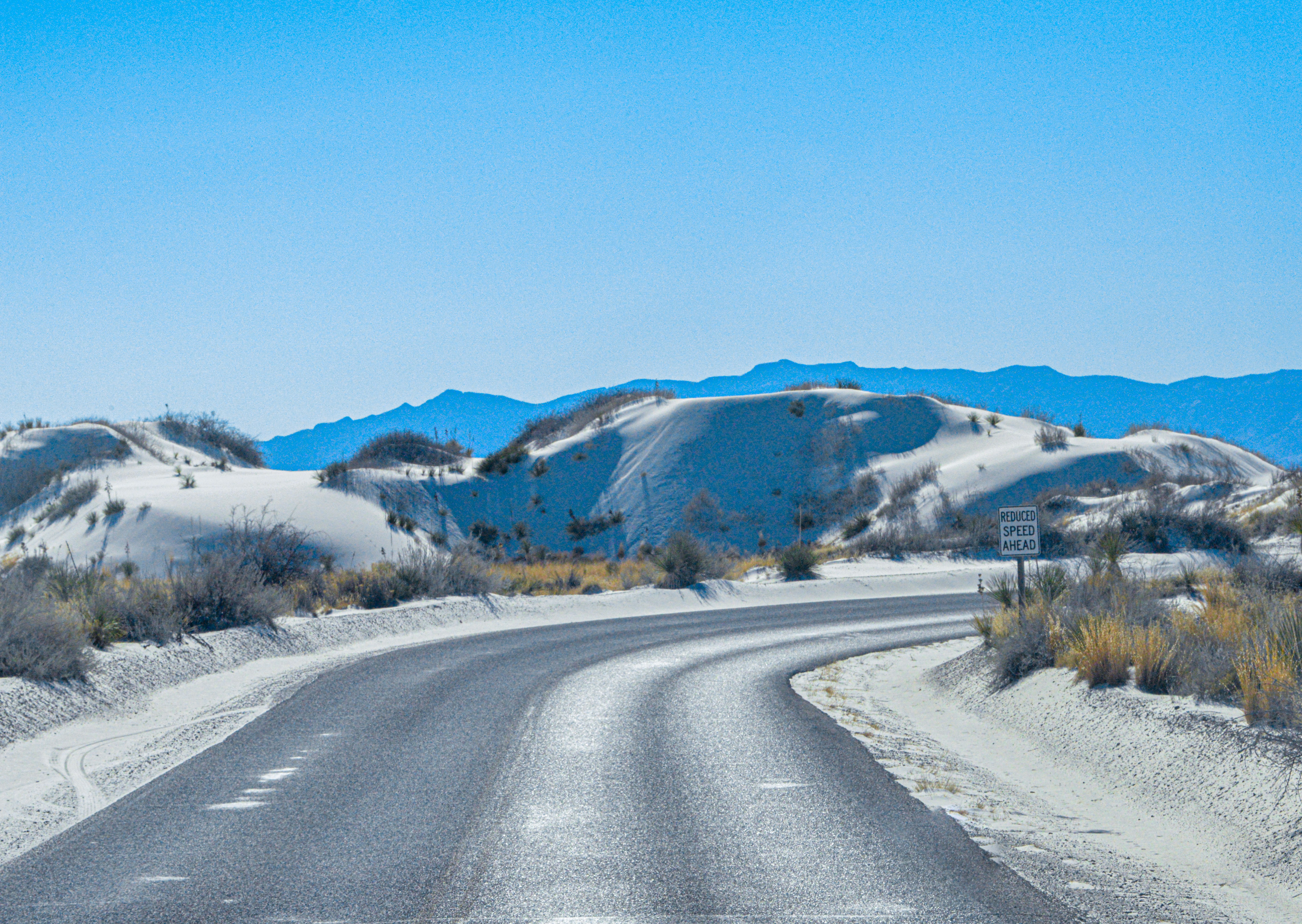 Snow on the Desert Road: A Winding Path Toward the Blue Horizon