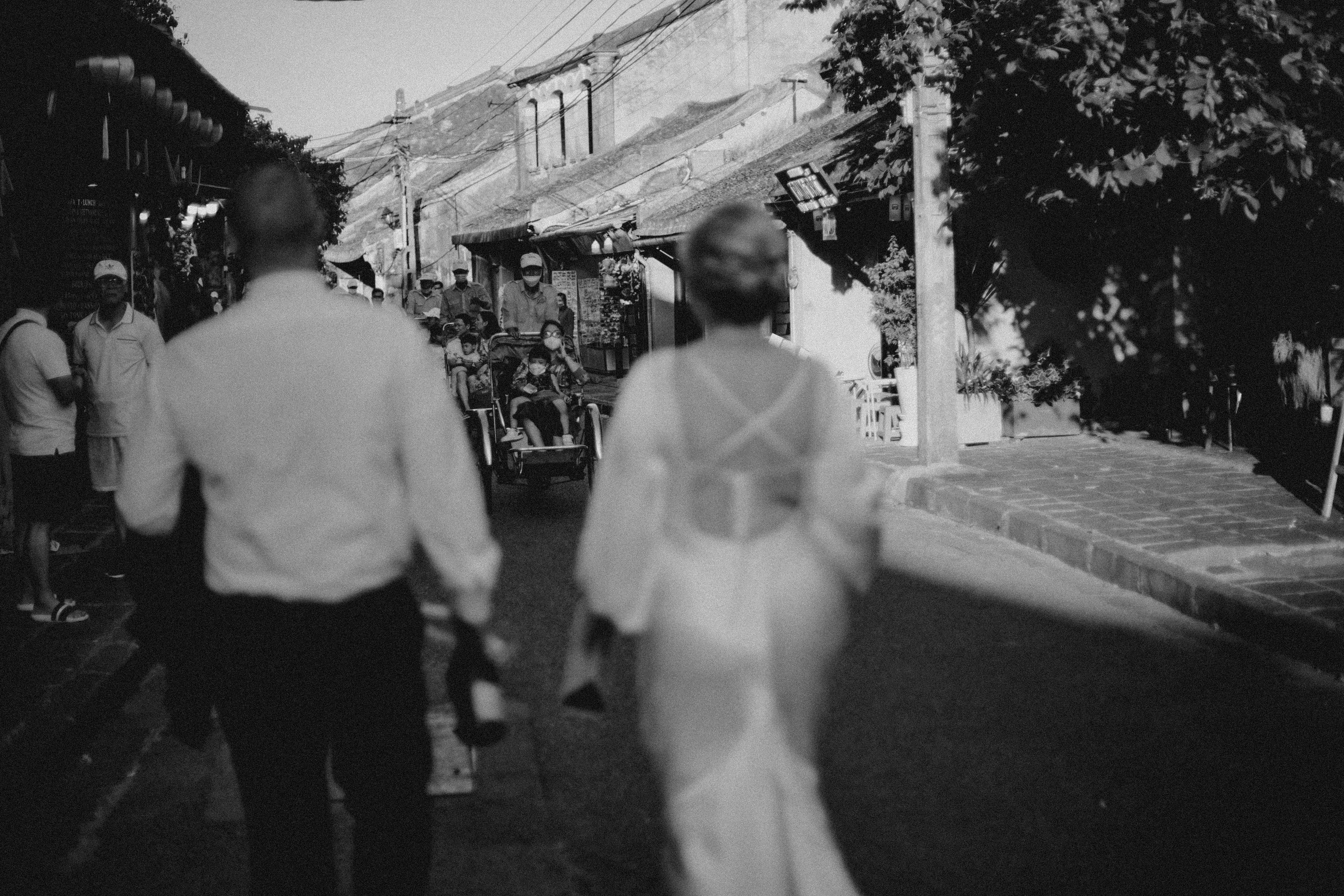 a man and a woman walking down a street