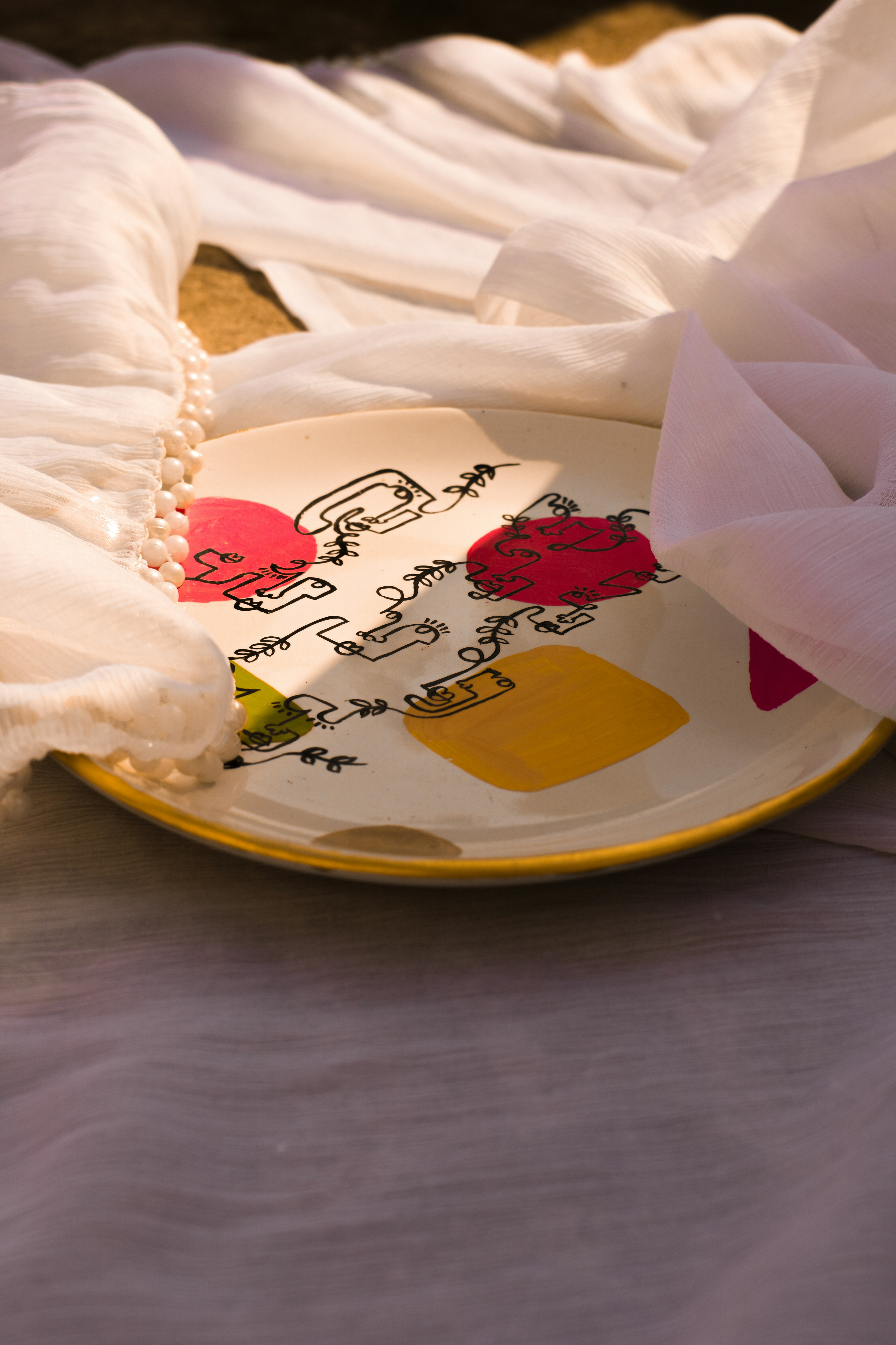 Heart-Doodle Plate Under Draped Linen