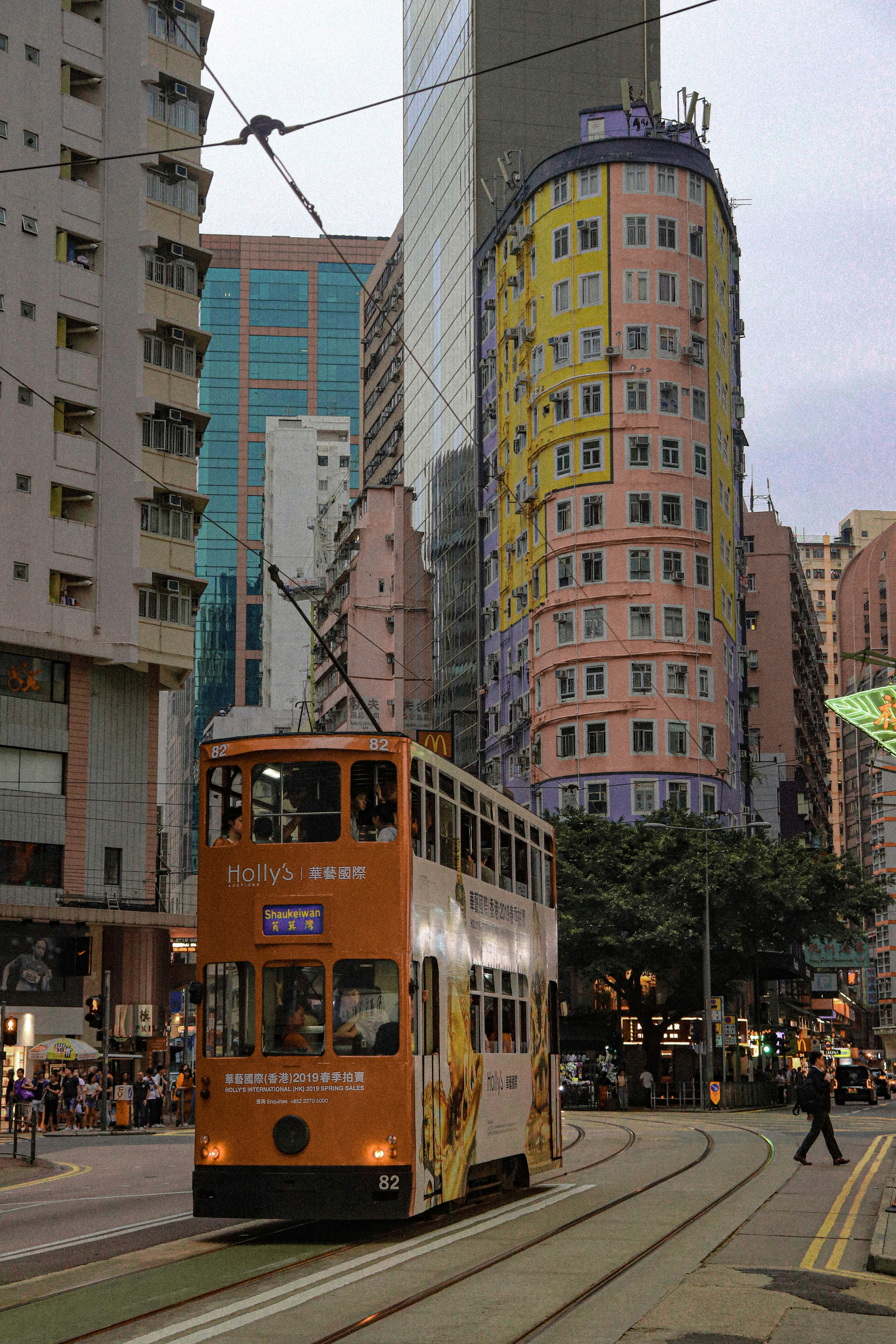 a double decker bus driving down a city street