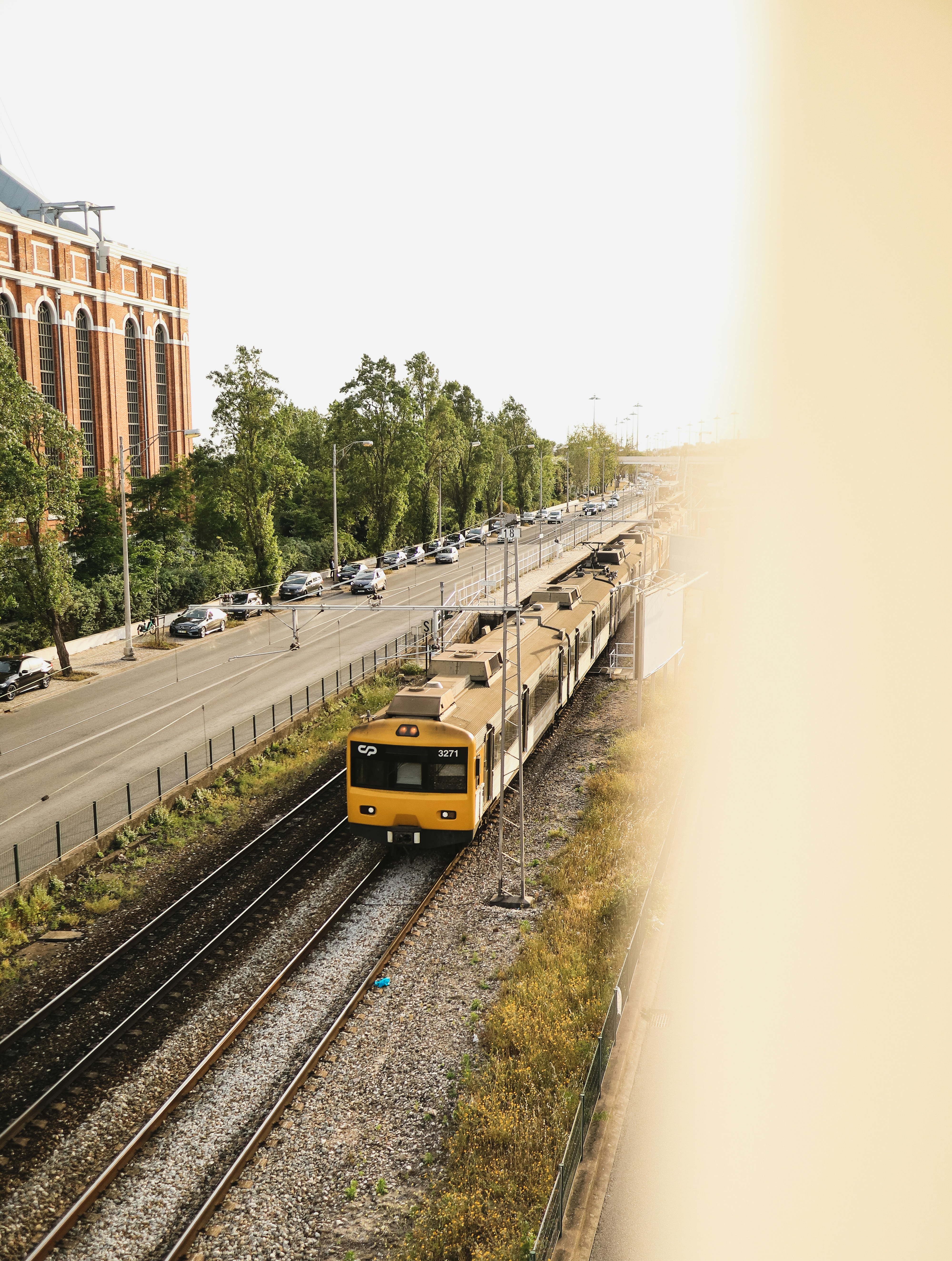 City Railcar on a Sunlit Track Through a Quiet Corridor
