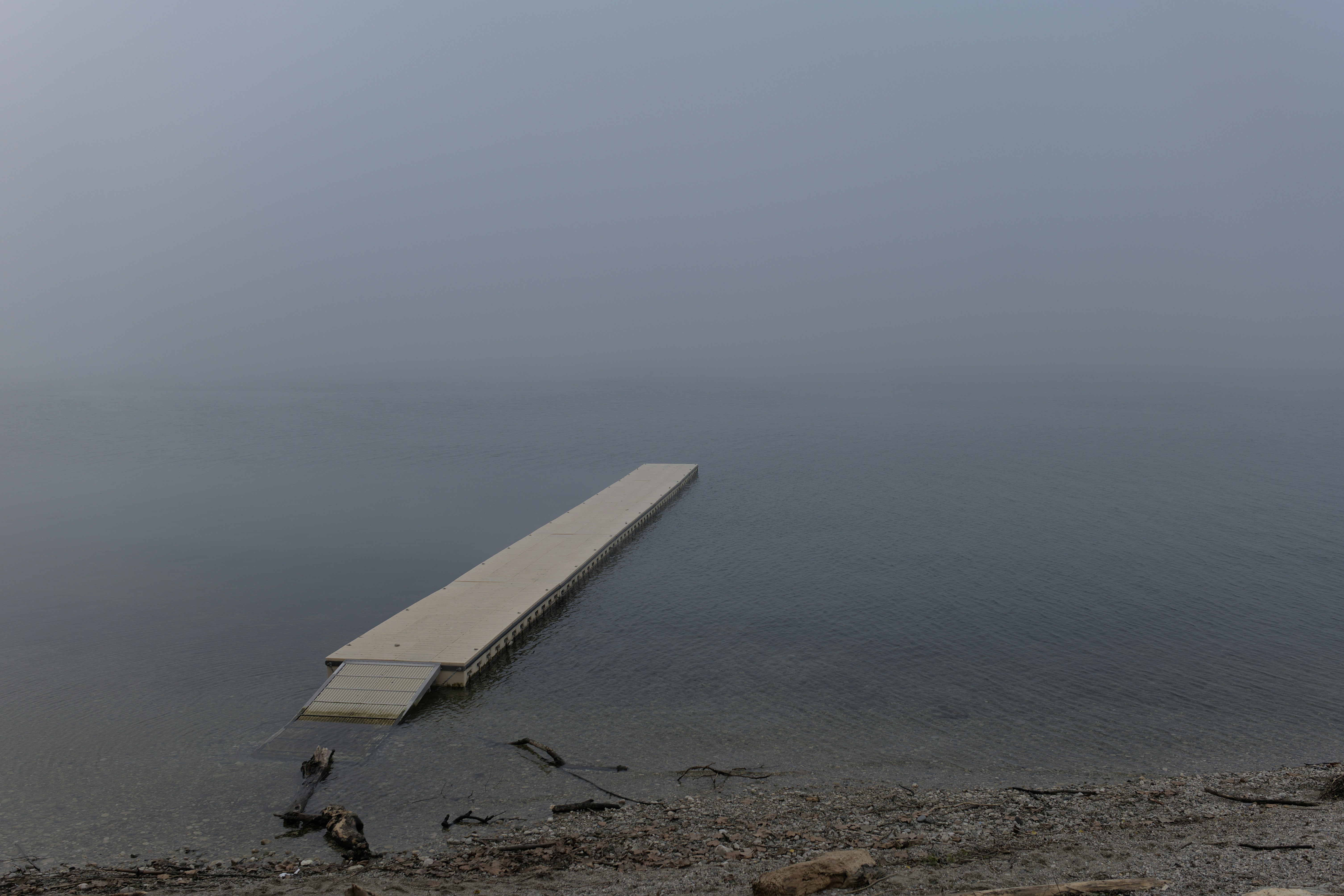Mistbound Pier Extends into a Quiet Horizon