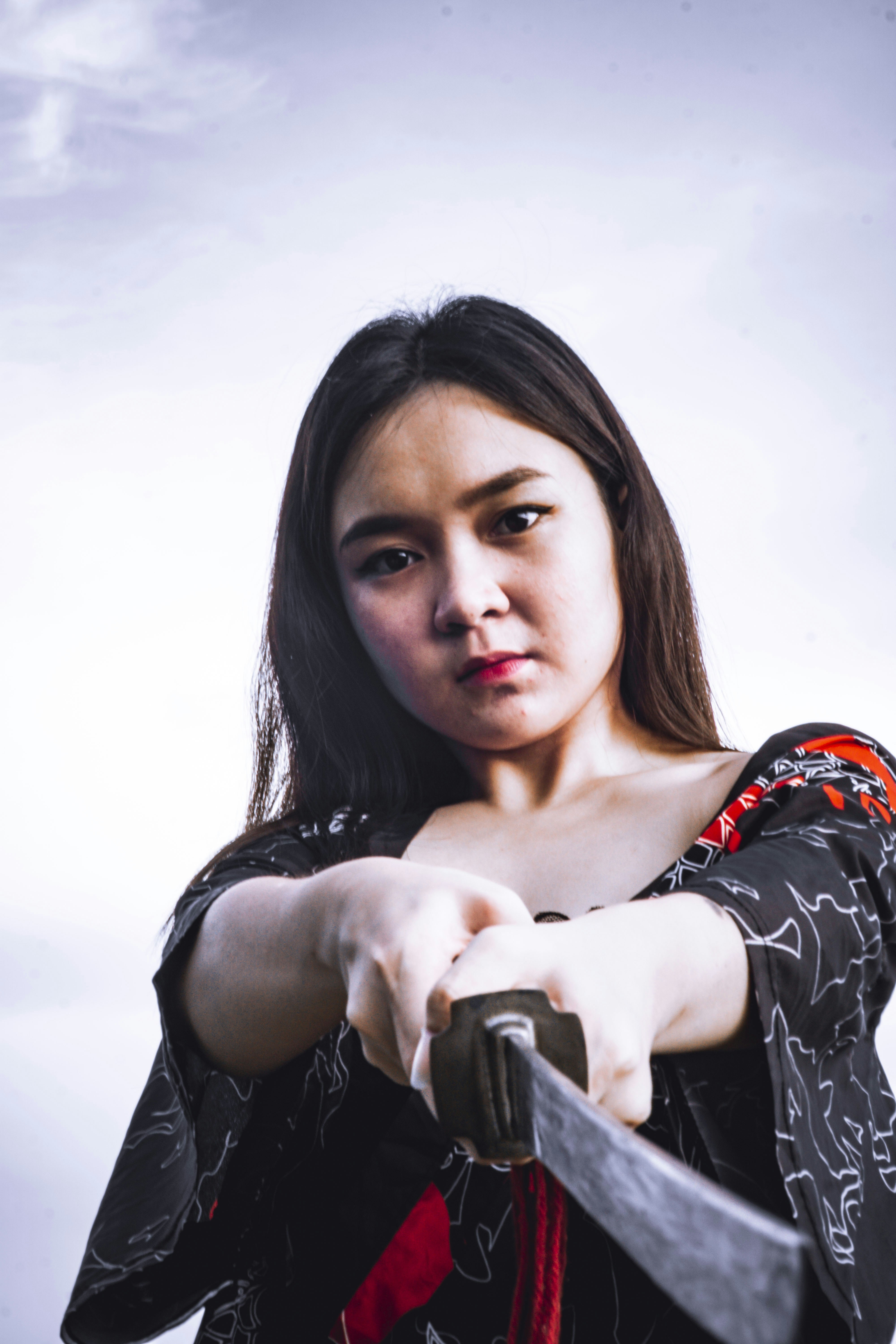 Eyes Meet Steel: Portrait with a Drawn Blade