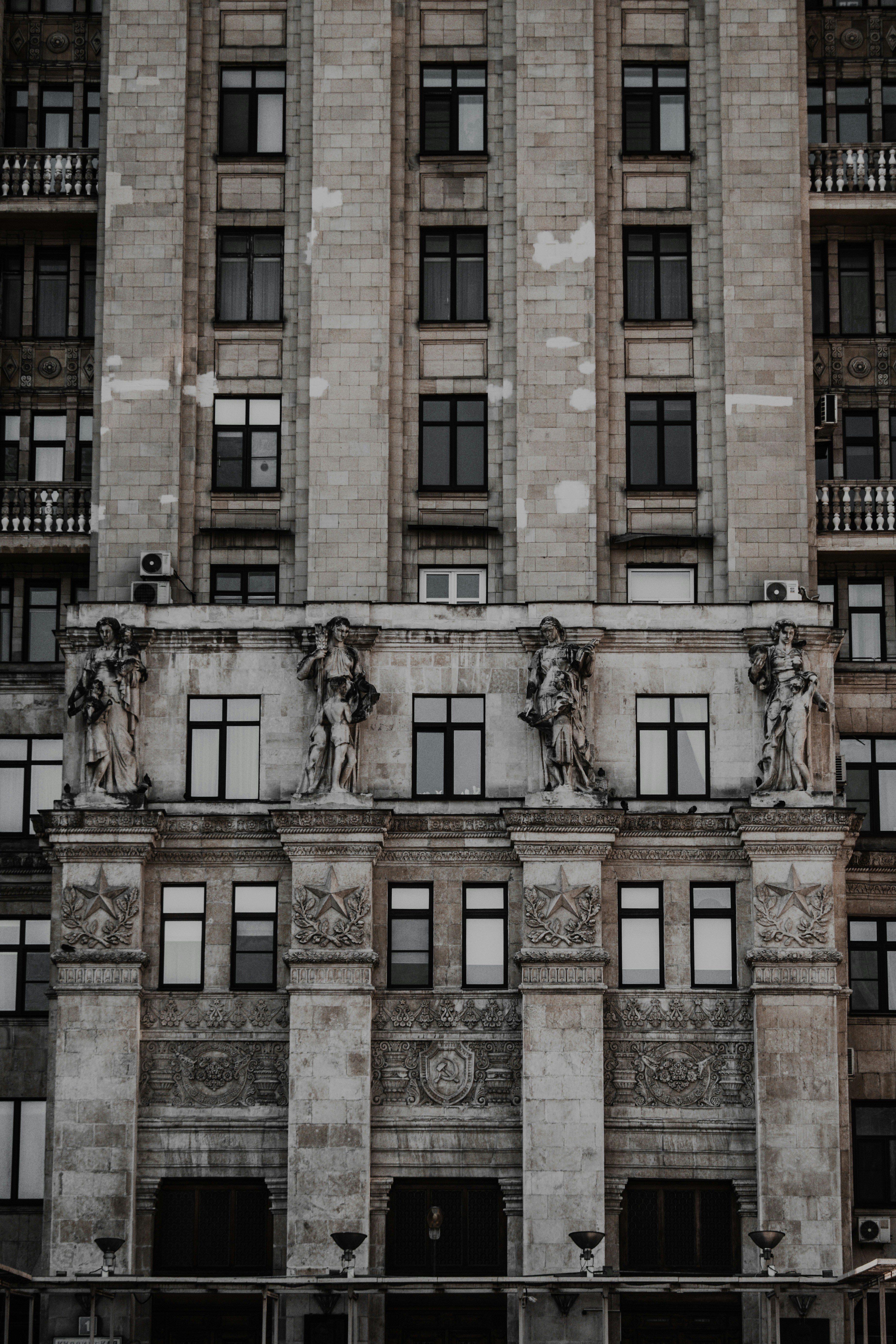 Historic building facade adorned with intricate sculptures and decorative elements, showcasing a blend of artistry and architectural grandeur.