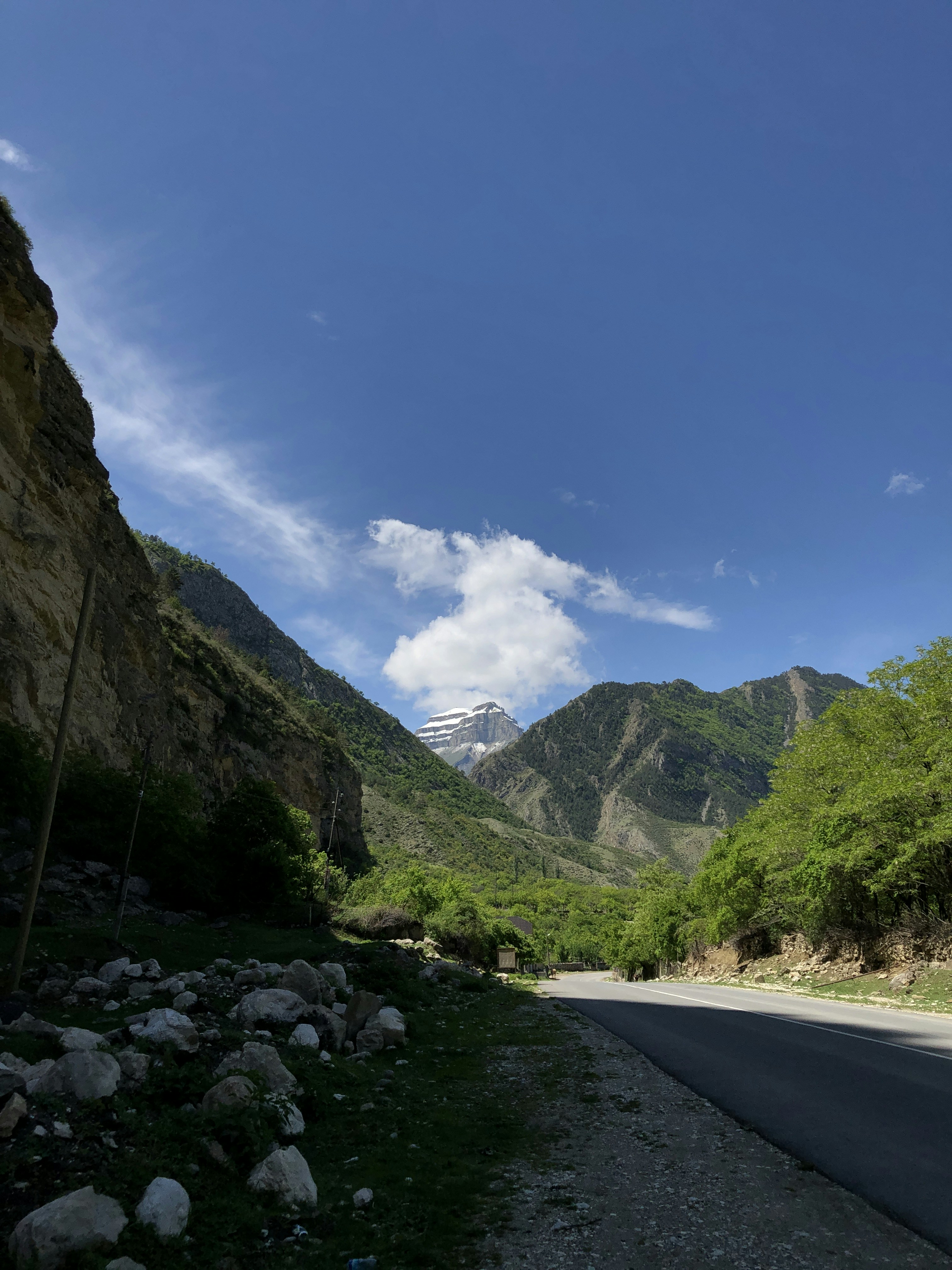 a view of a mountain range from a road