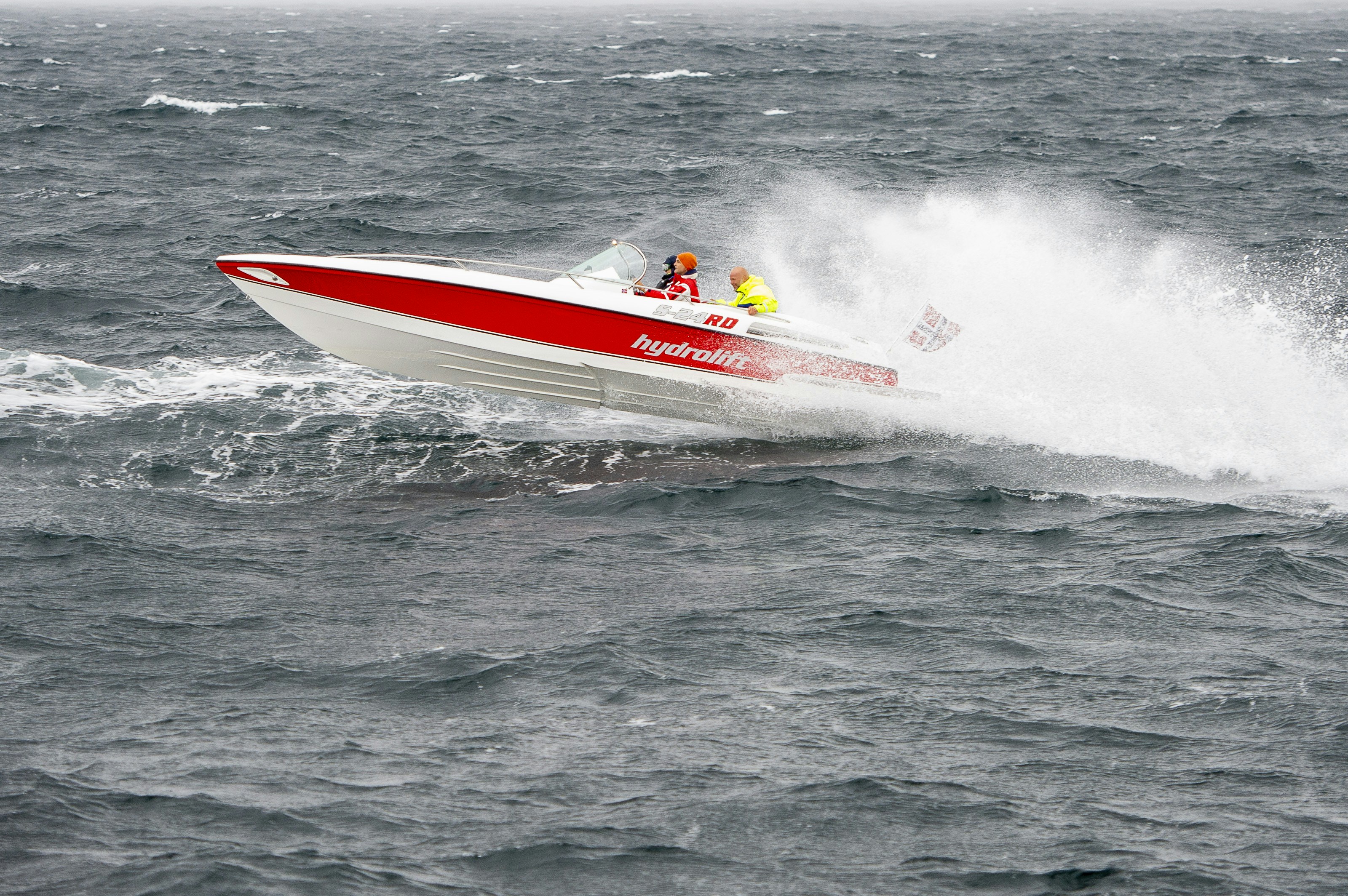 A red and white speed boat in the ocean photo – Free Transportation ...