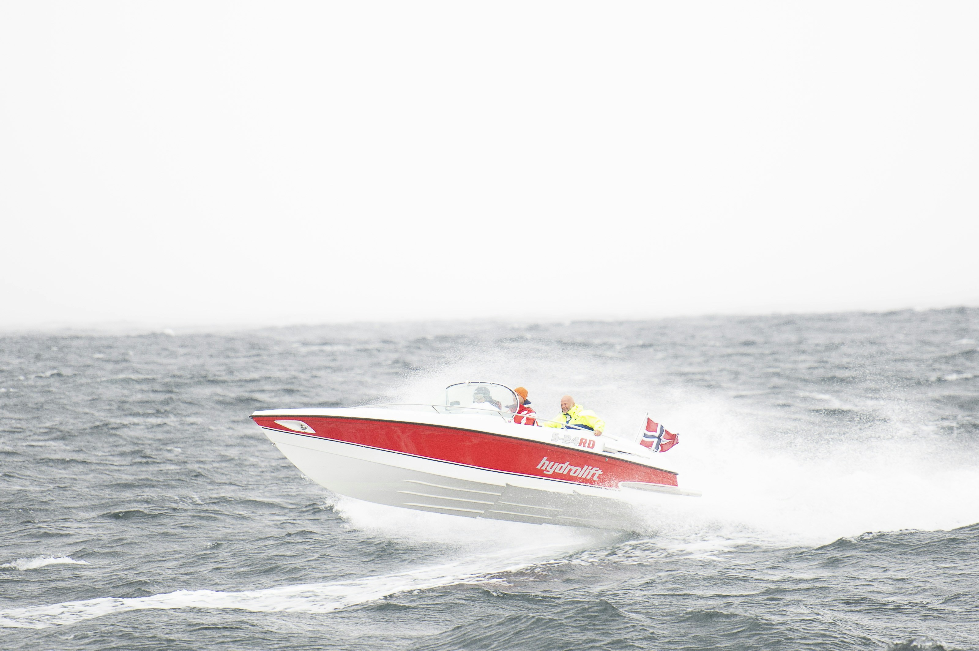 A red and white speed boat in the ocean photo – Free Vehicle Image on ...